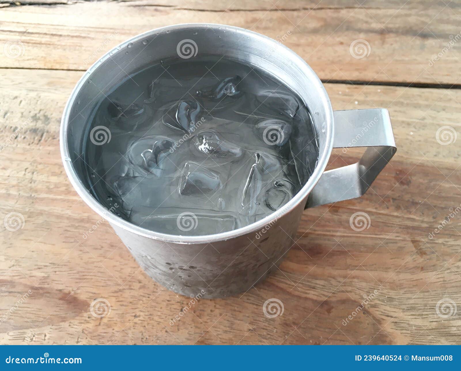Stainless Steel Glass with Ice on Table Stock Photo - Image of table ...
