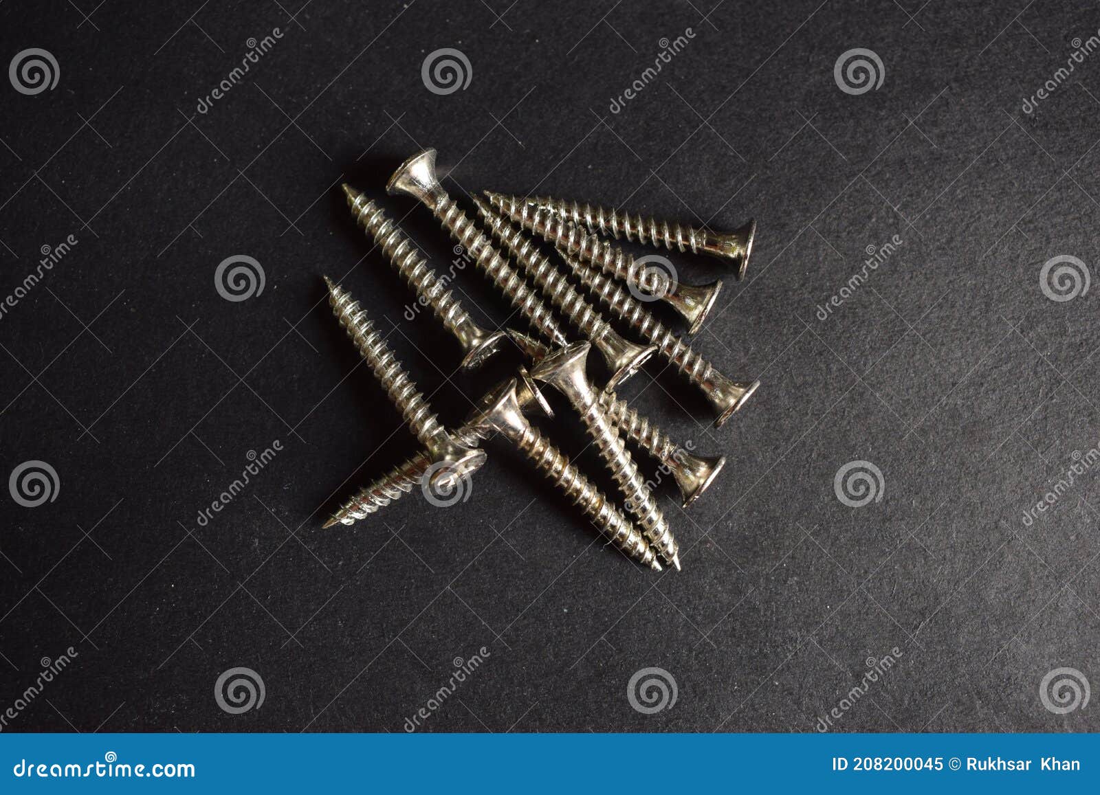 Stainless Steel Star Screws on Black Background Stock Image - Image of ...