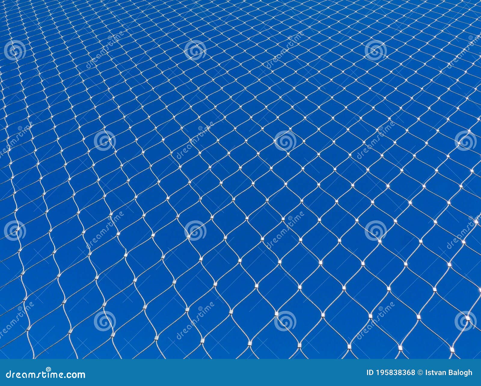 Twisted Wire Cable Mesh in Diminishing Perspective with Blue Sky Stock ...