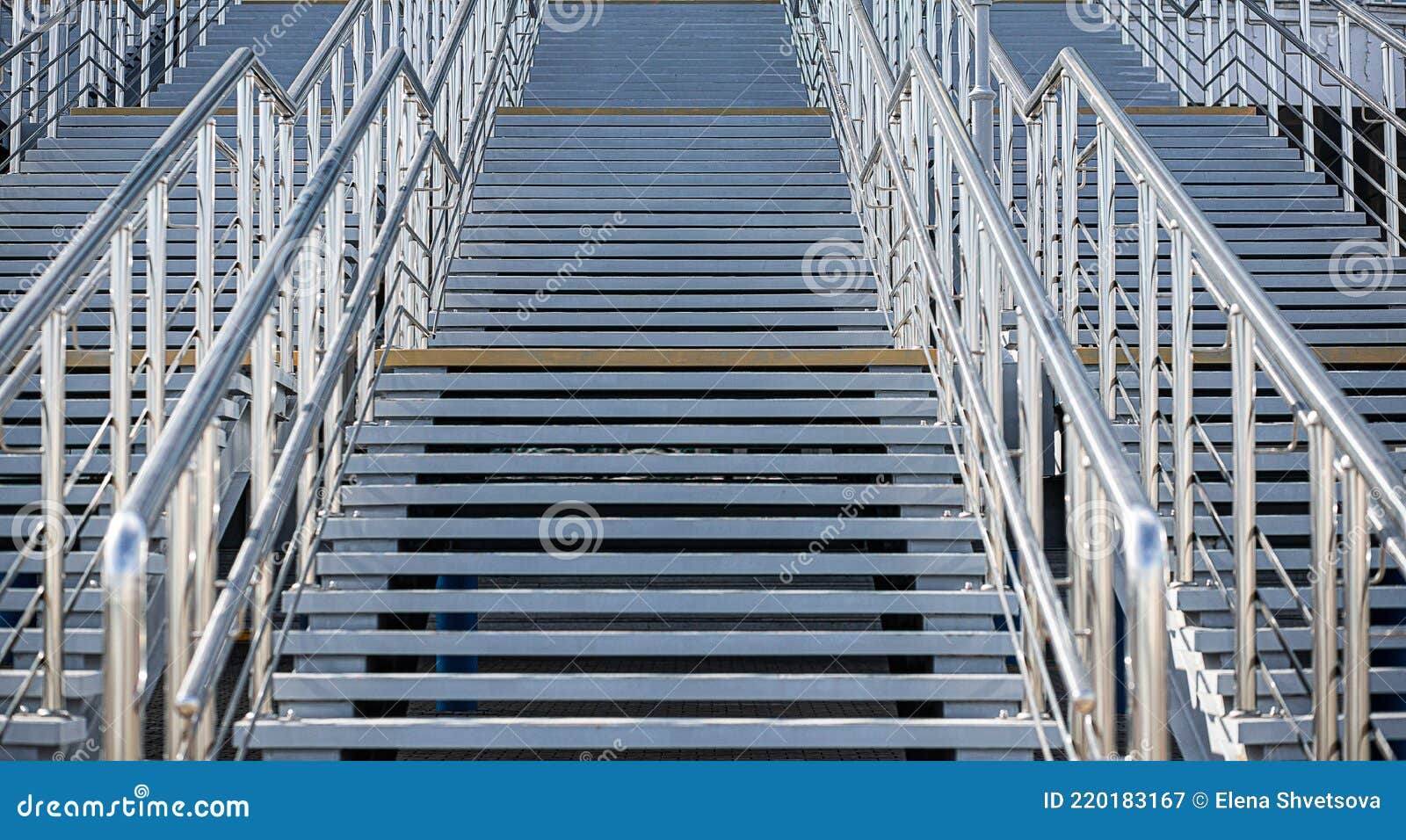 A Staircase with Gray Concrete Steps and a Metal Railings Leading Up ...