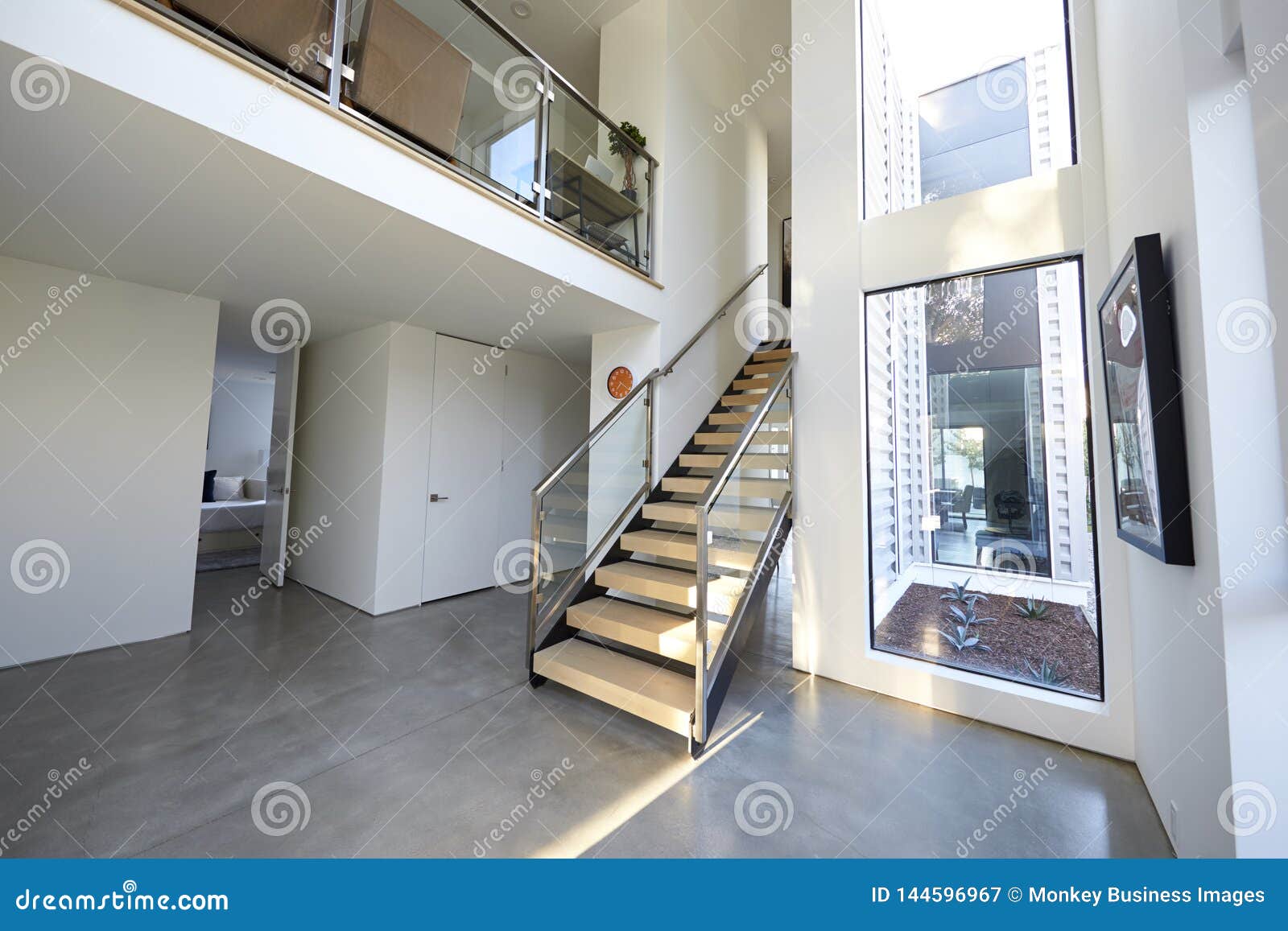 Staircase and Hallway in Stylish and Contemporary Empty Home Stock ...