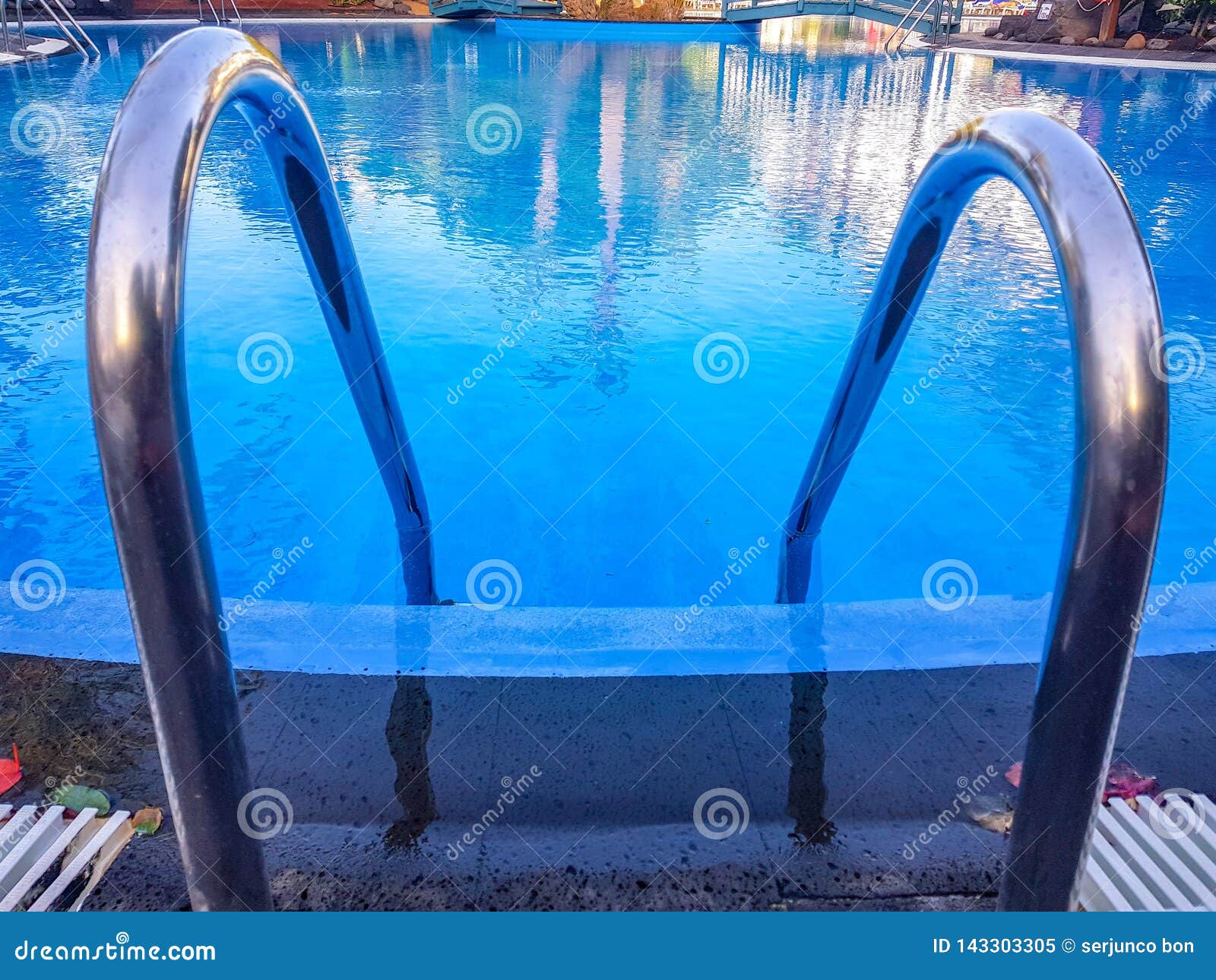 Stairs of a swimming pool stock image. Image of poolside - 143303305