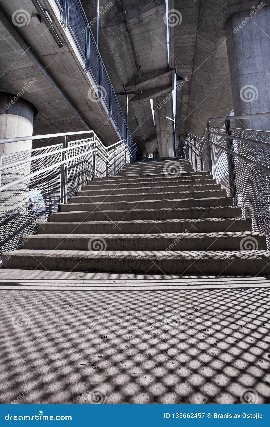 Stairs under urban bridge stock image. Image of shape - 135662457
