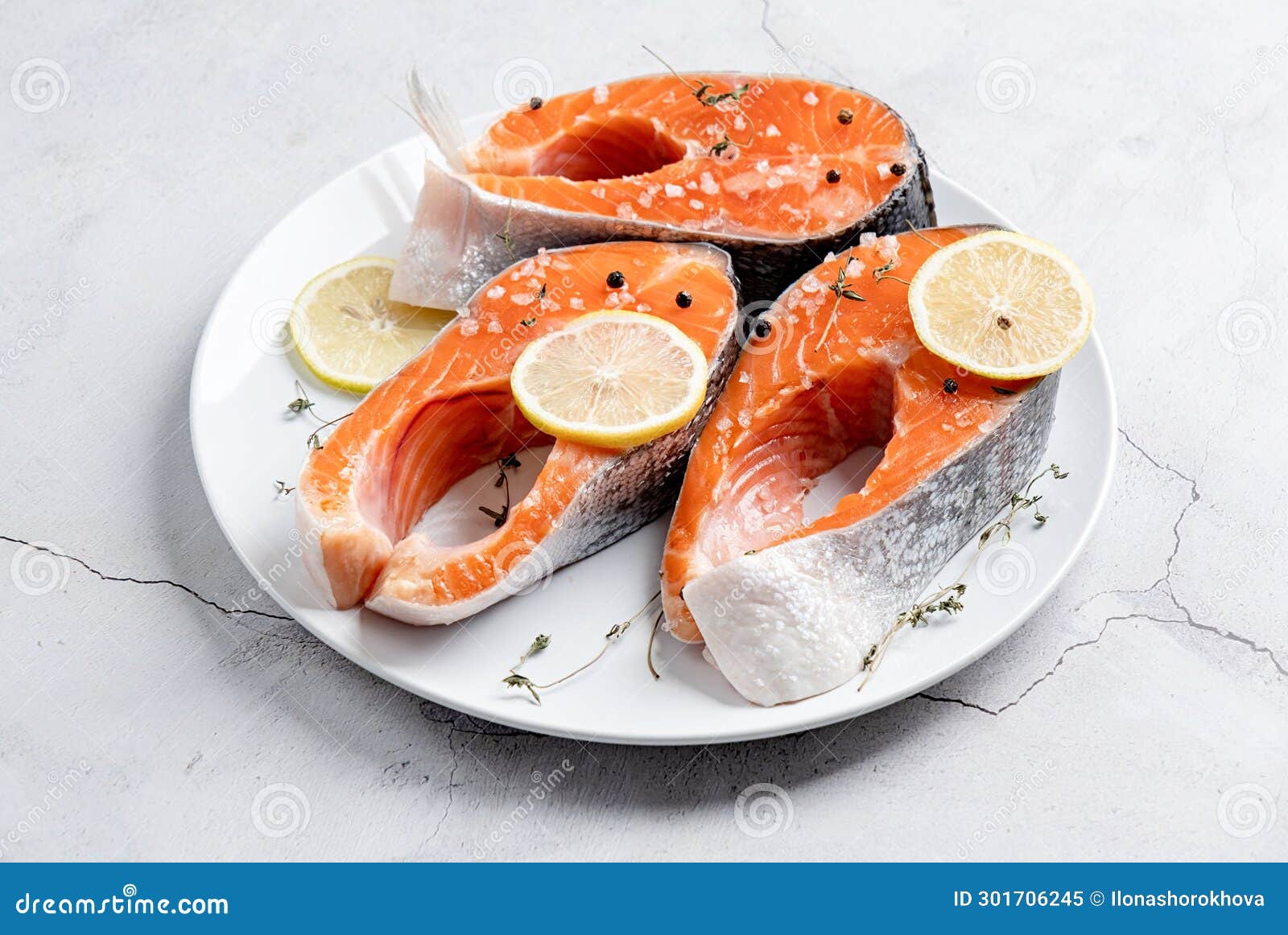Stake Fish Trout with Lemon and Spices on Cement Background Stock Image ...
