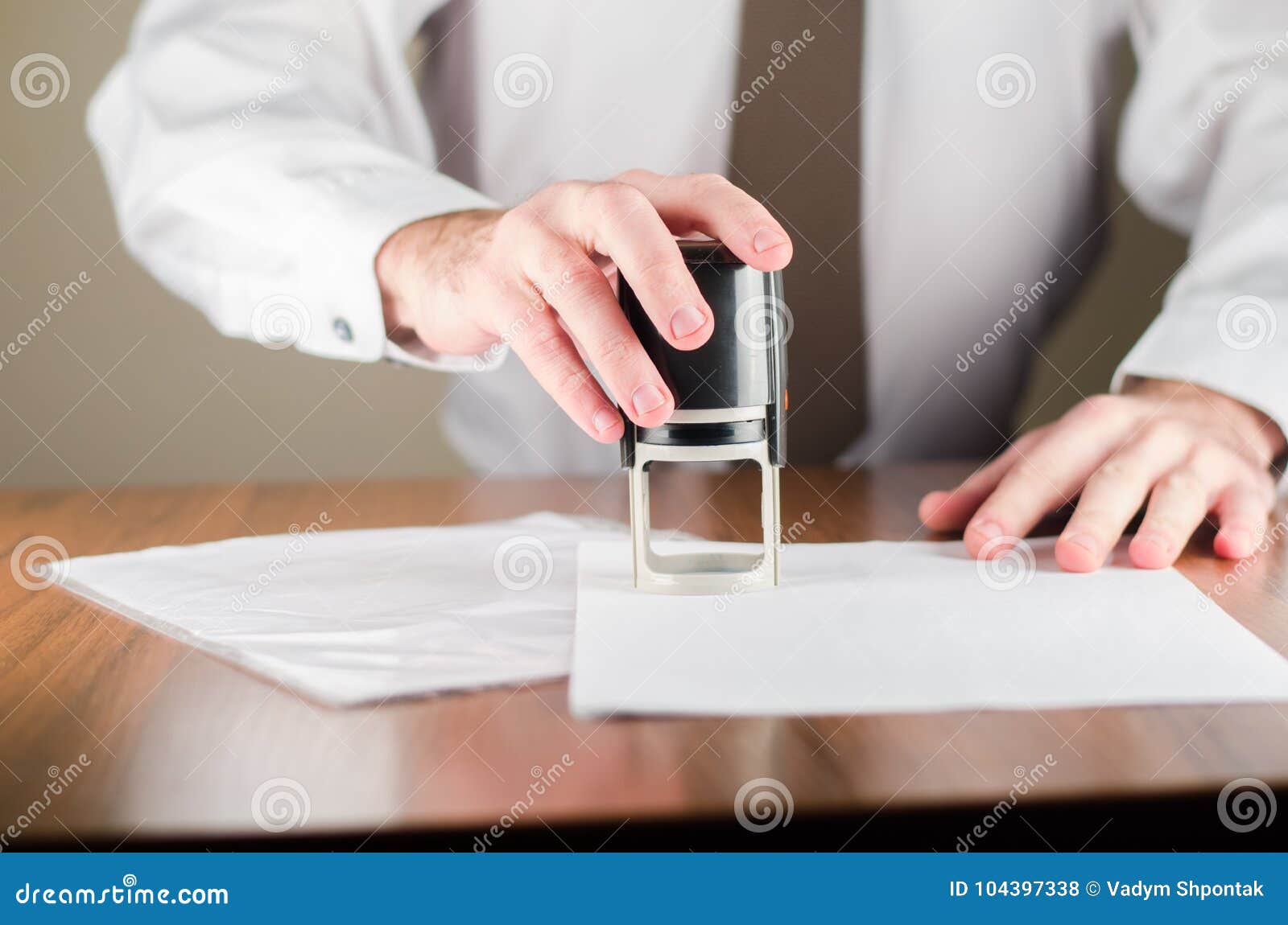 Stamp a seal on the table stock photo. Image of paper - 104397338