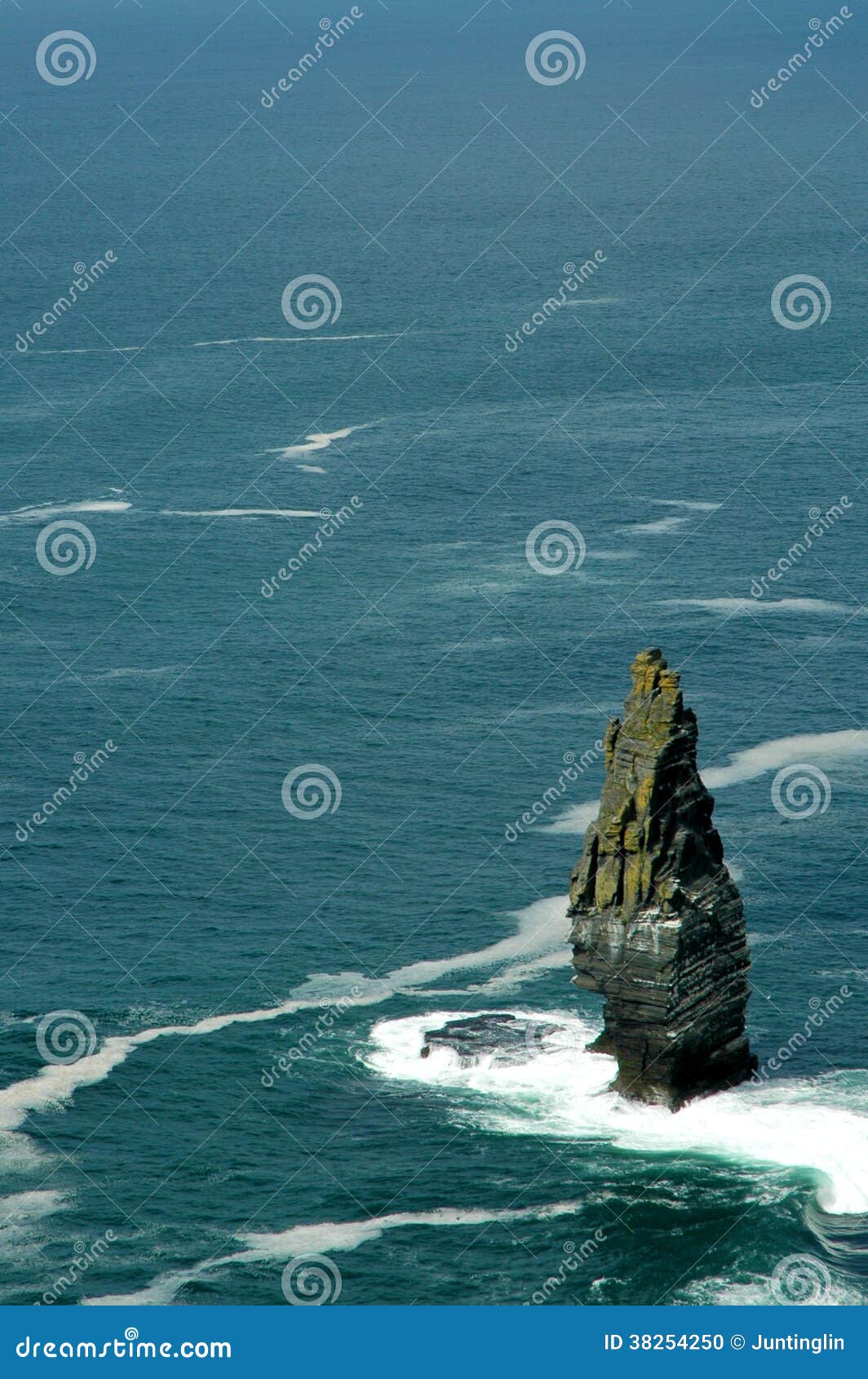 A Stand Alone Rock on the Ocean Stock Photo - Image of tough, fearless ...