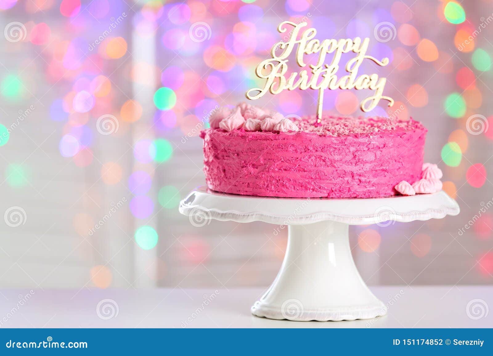 Stand with Delicious Birthday Cake on Table Against Blurred Lights ...