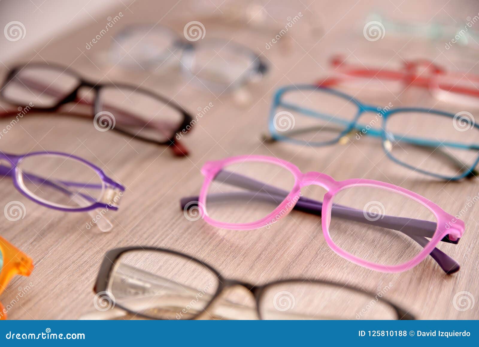 Assortment of Glasses on Table in an Eyewear Store Stock Photo - Image ...