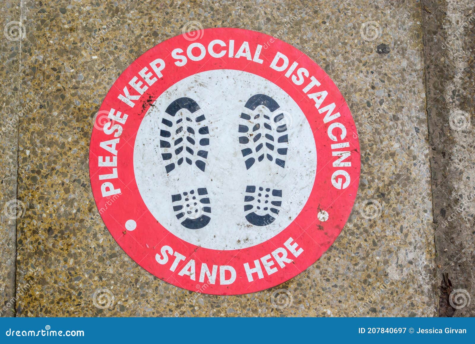 STAND HERE Floor Sticker on a Pavement Stock Image - Image of ...