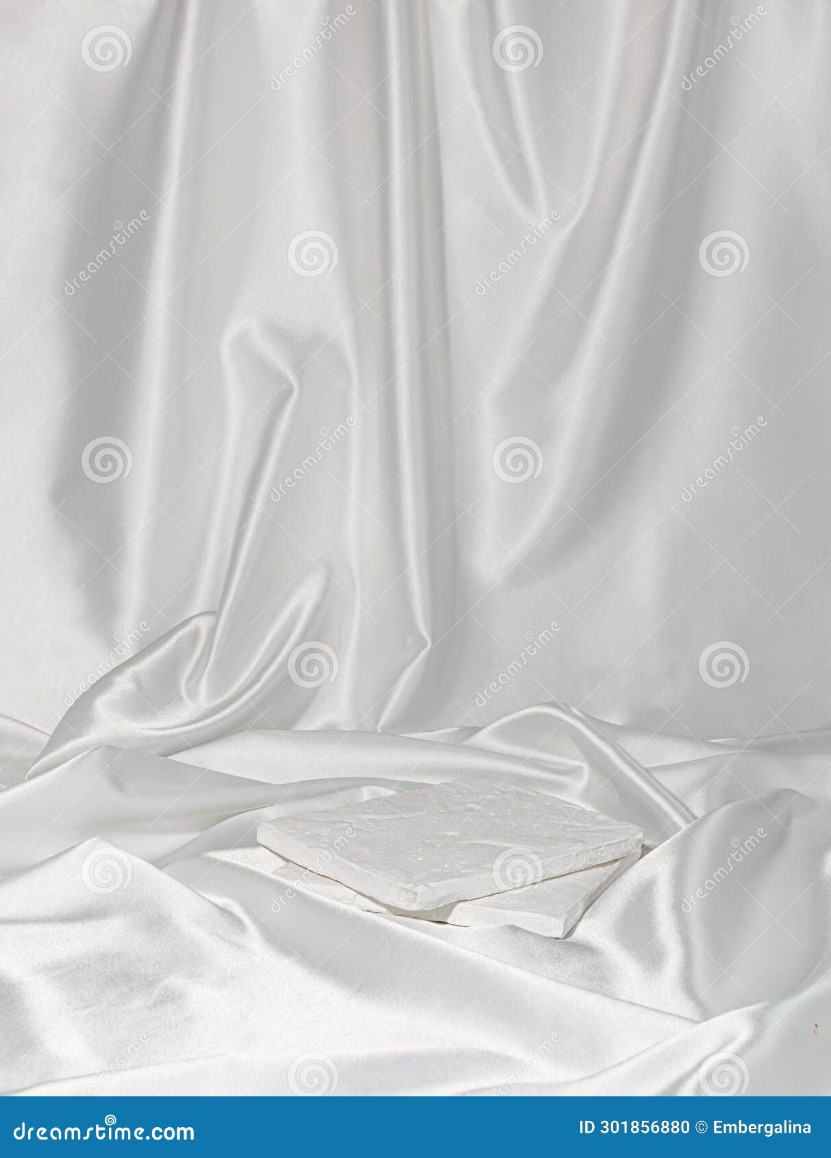 The Stand Made of White Stone Lies on a White Satin Draped Background ...