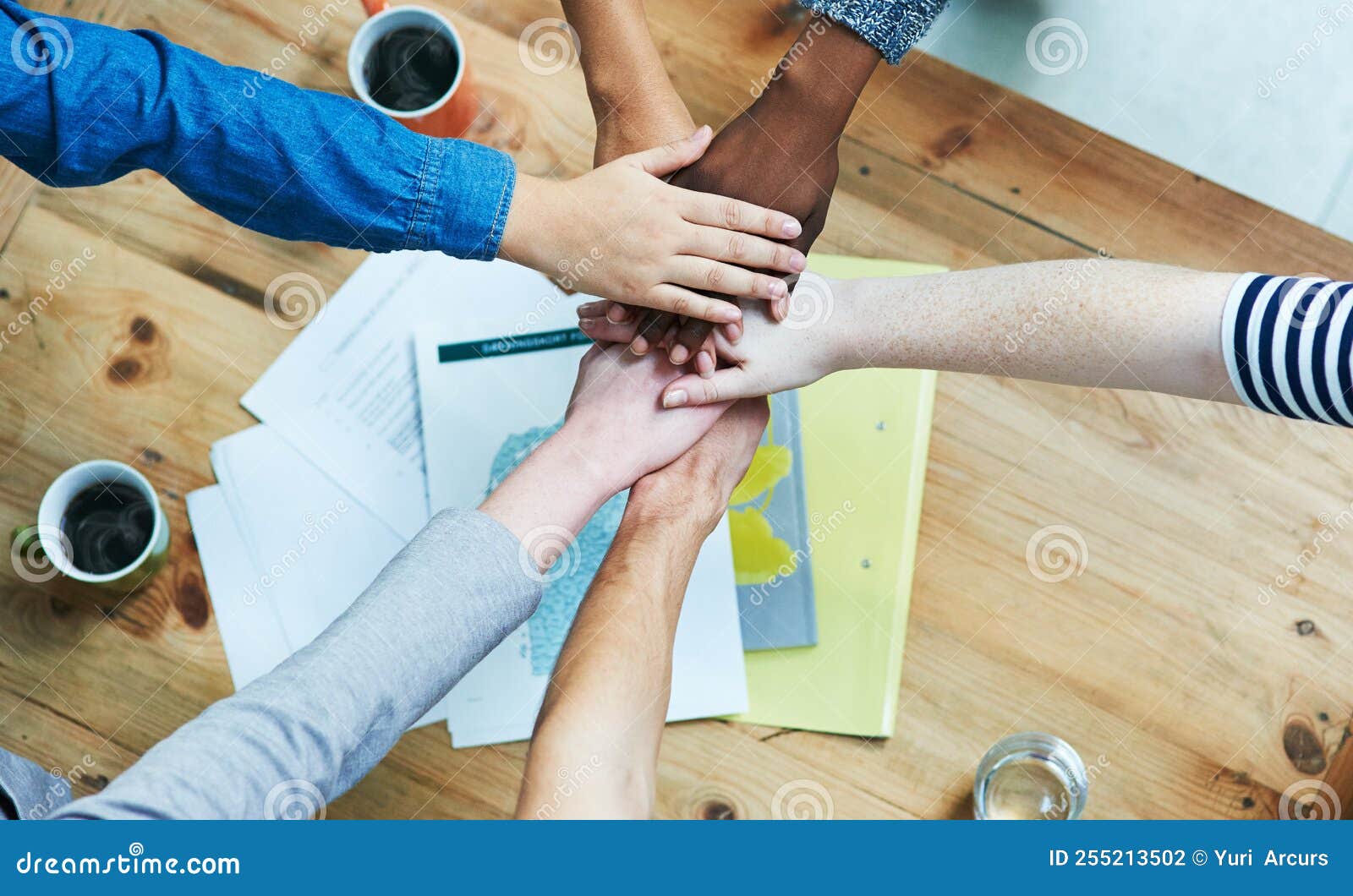 We Stand United. a Group of Hands Reaching Forward Together. Stock ...