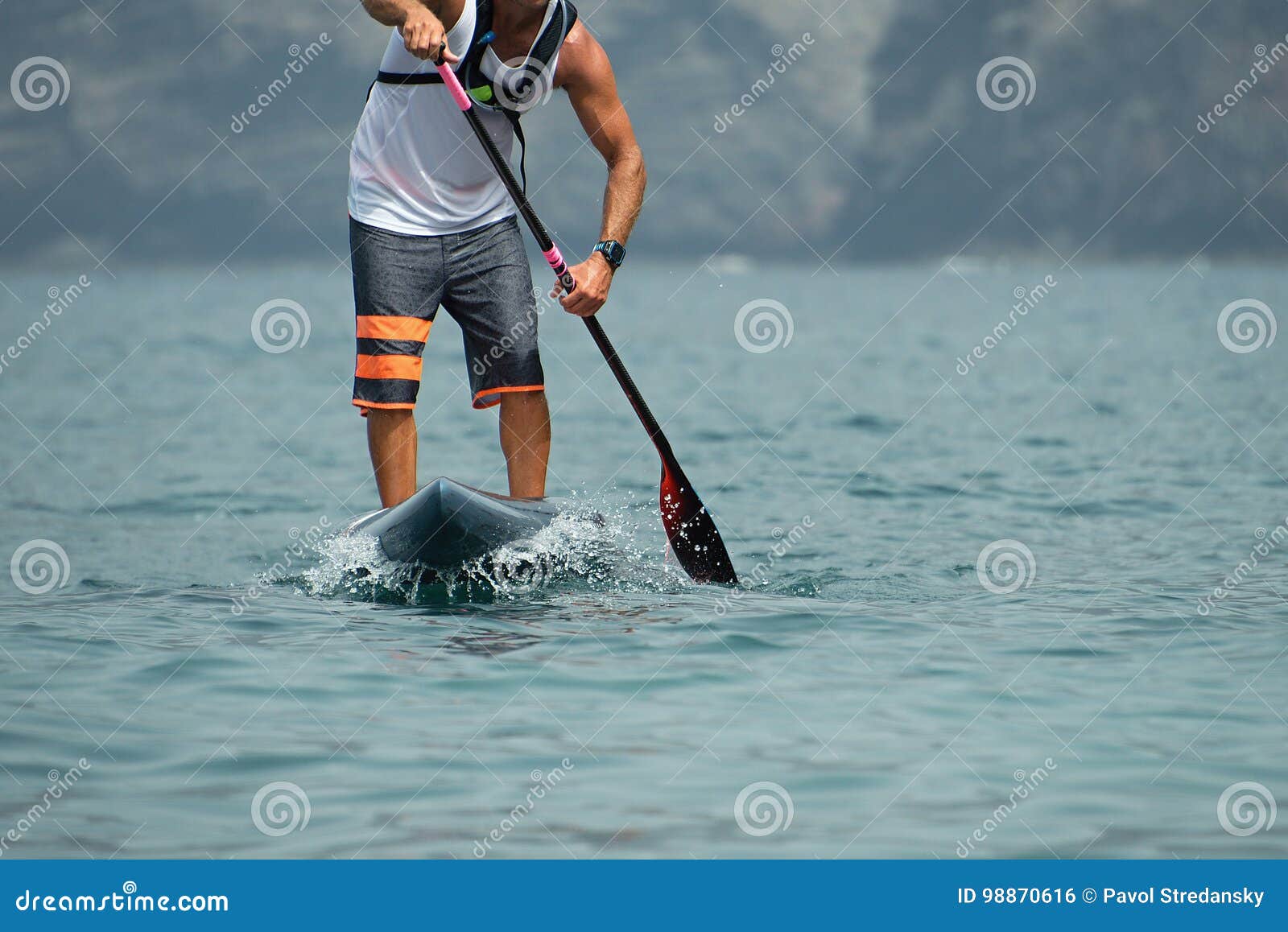 Stand Up Paddle Boarding On A Quiet Sea Lake , Close-up Of Legs And ...