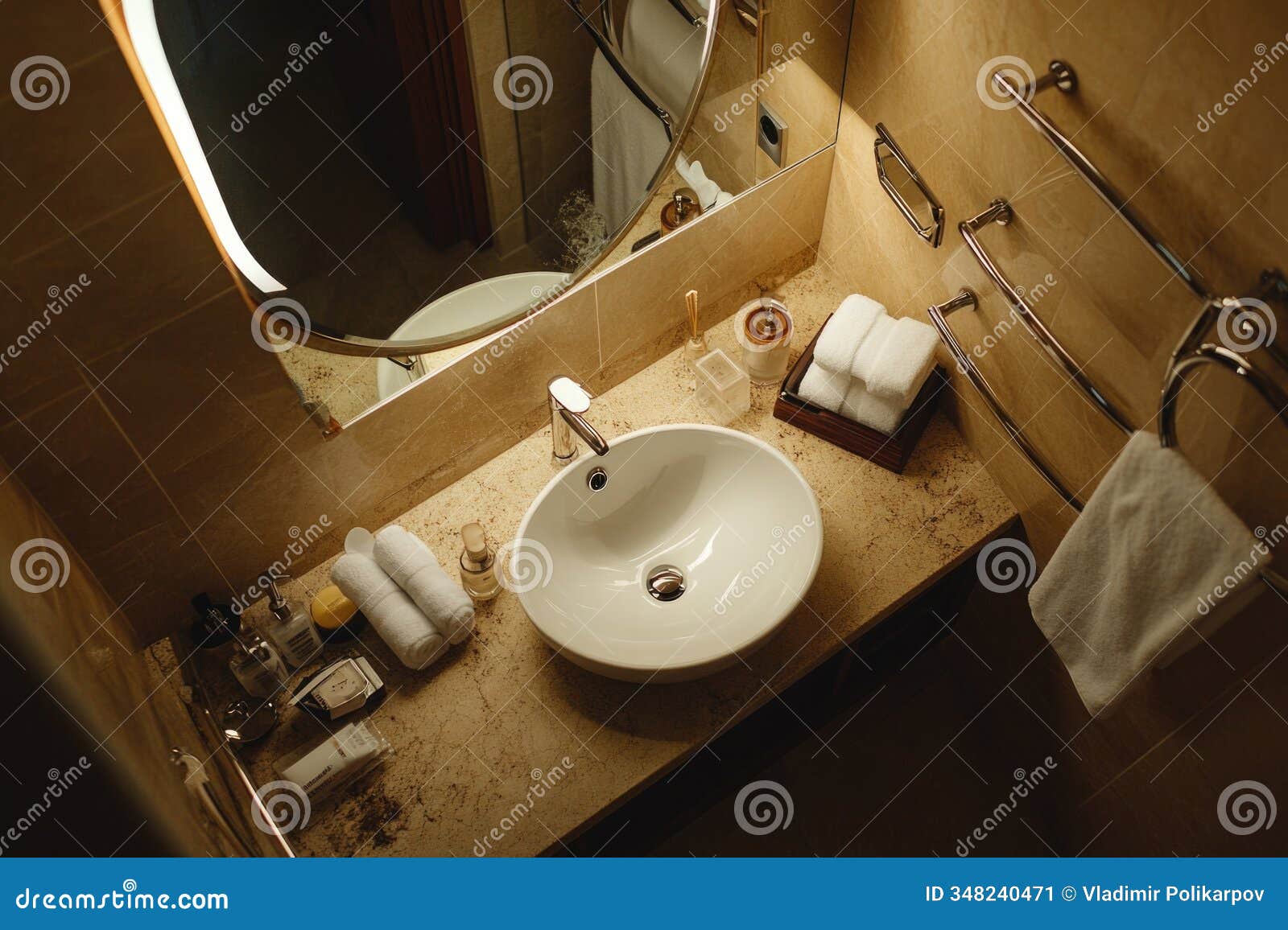 A Standard Bathroom Setup Featuring a Sink, Mirror, and Toilet Stock ...