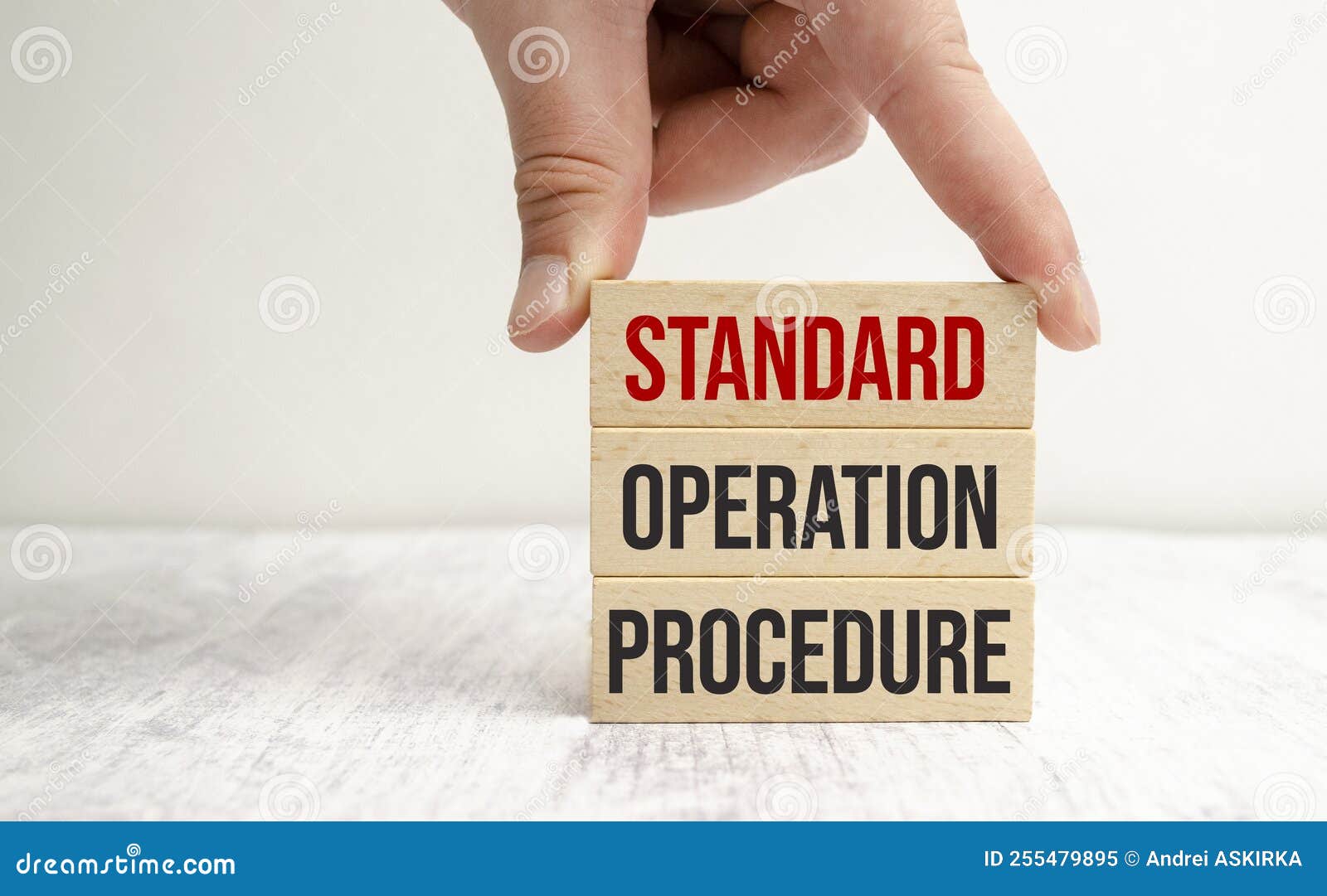 Standard Operation Procedure Words on Wooden Blocks and Hand Stock ...