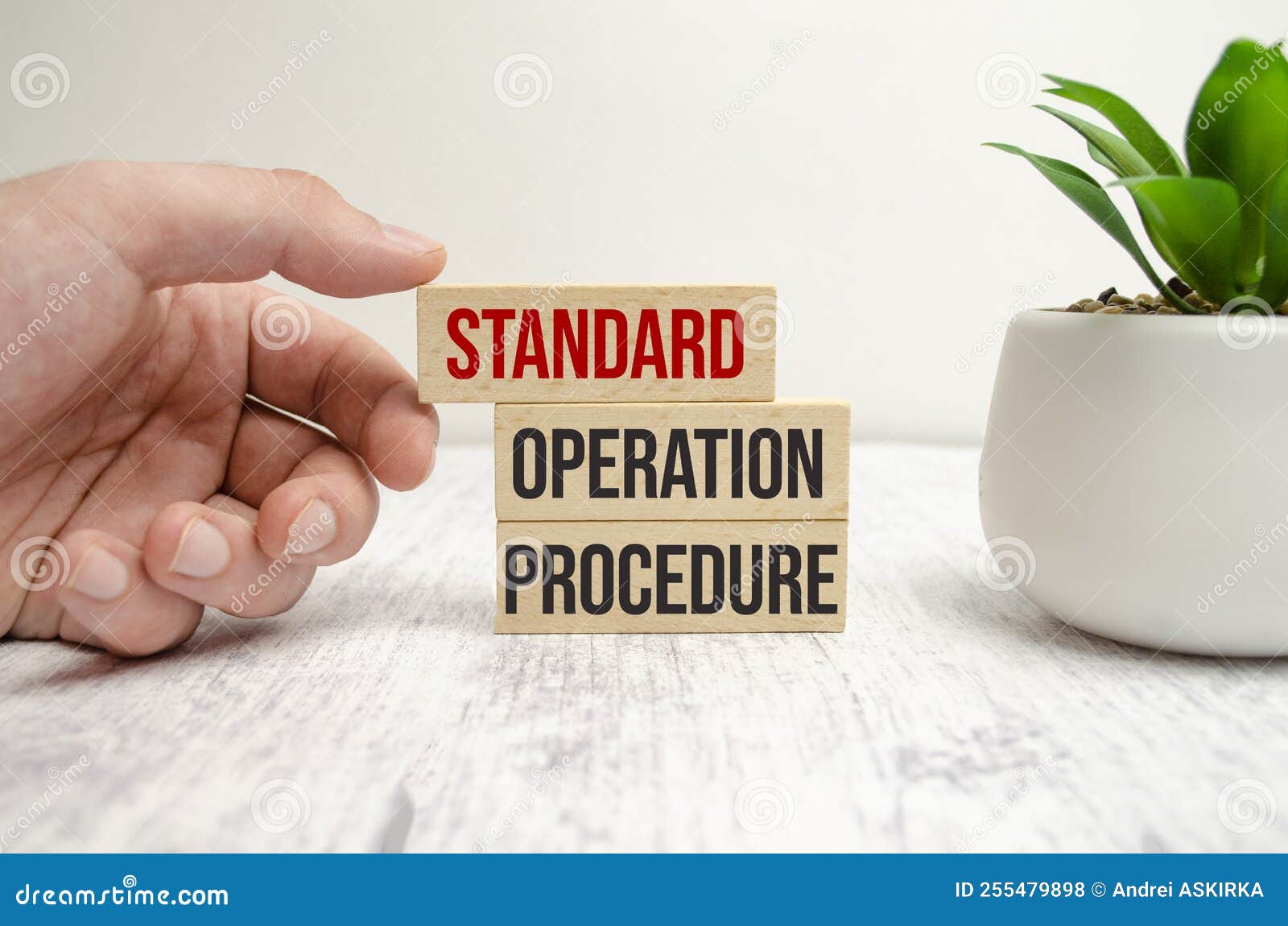 Standard Operation Procedure Words on Wooden Blocks and Hand Stock ...