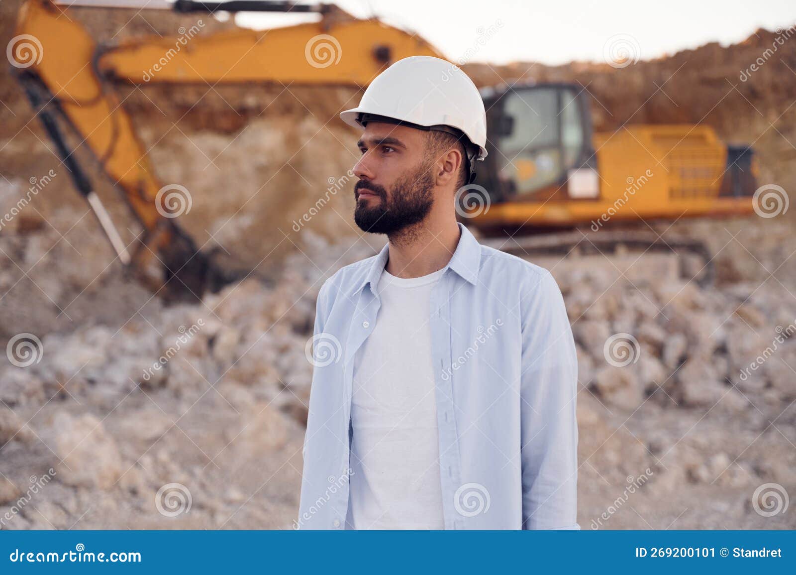 Standing Against Excavator. Man in Uniform is Working in the Quarry at ...