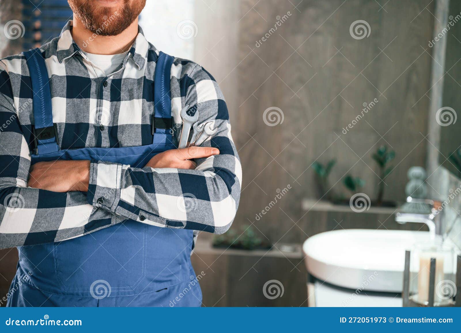 Standing with Arms Crossed. Plumber in Blue Uniform is at Work in the ...