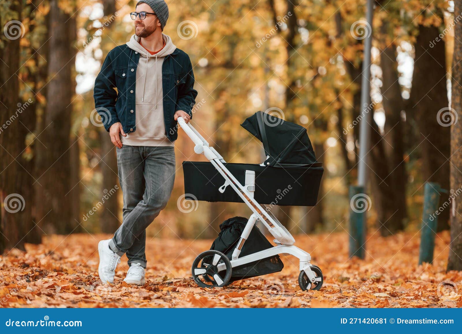 Standing and Enjoying a Nature. Man with Pram is Having a Walk in the ...