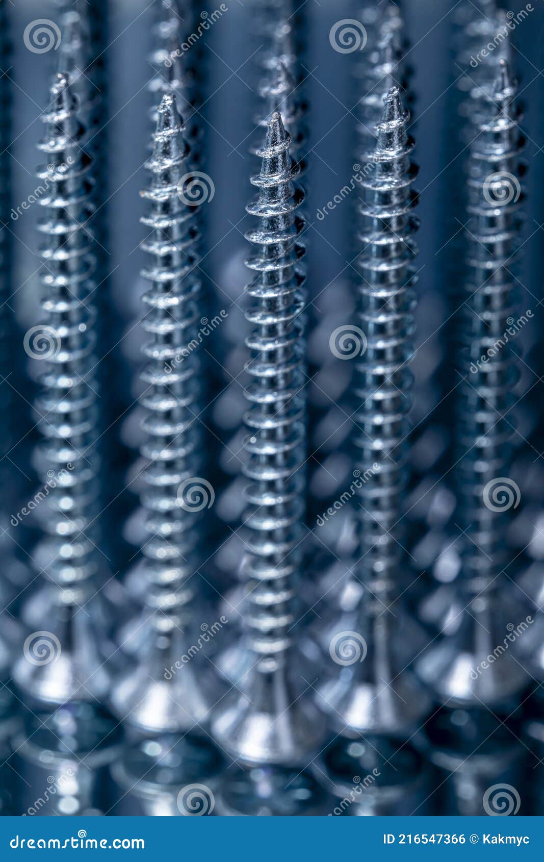 Standing Galvanized Self-tapping Screws on a Mirror Surface Stock Photo ...