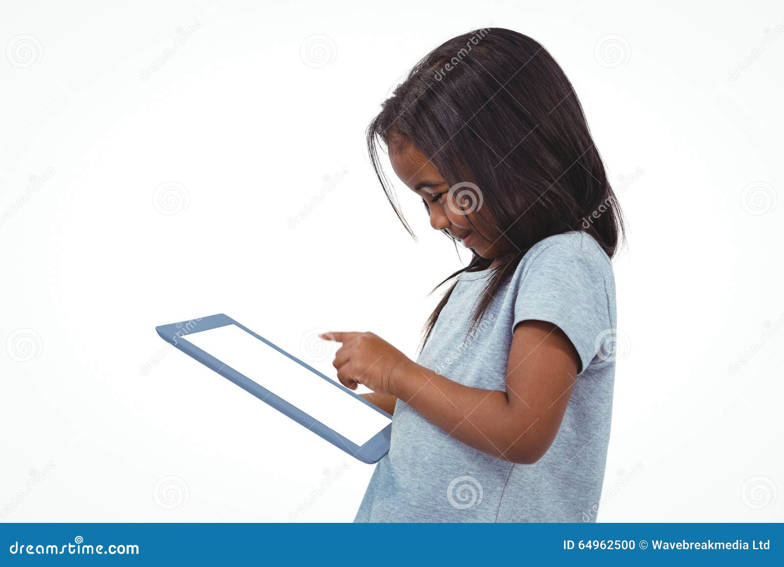 Standing girl using tablet stock photo. Image of scrolling - 64962500