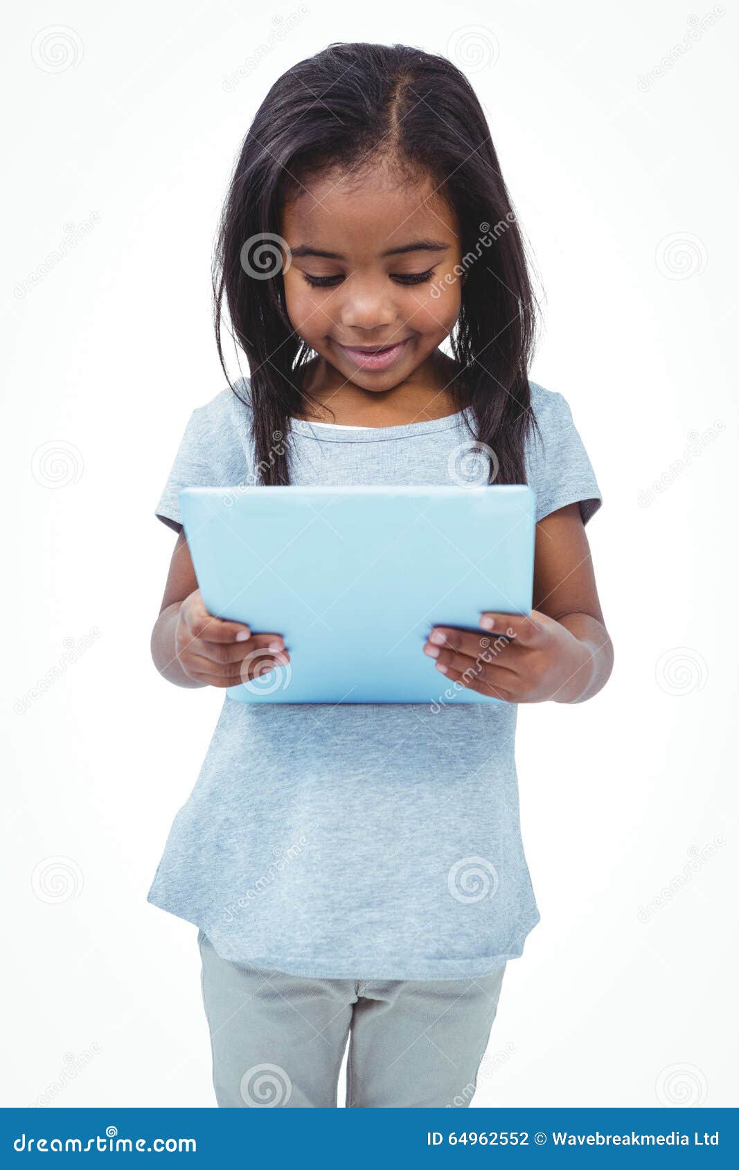 Standing girl using tablet stock photo. Image of scrolling - 64962552