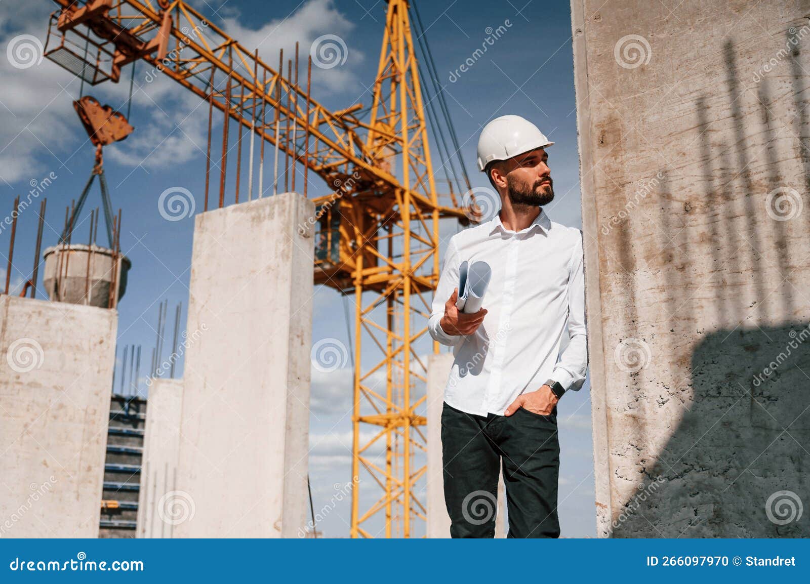 Standing and Holding Plan in Hands. Man in Uniform is Working on the ...