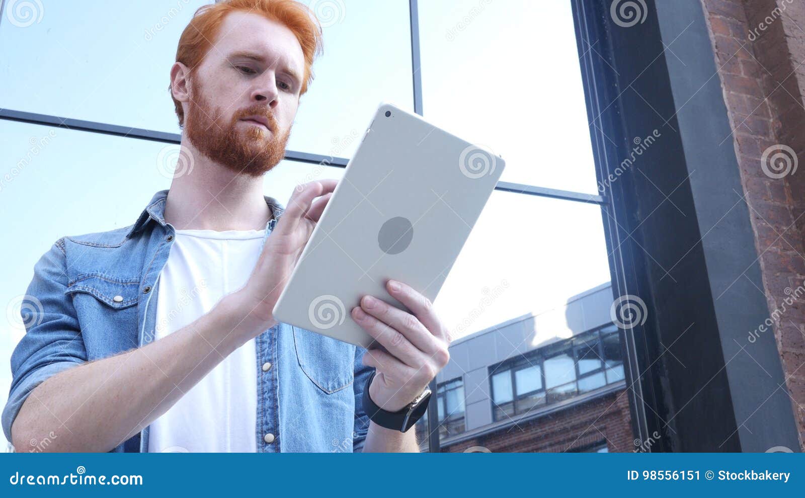 Standing Man Using Tablet PC Stock Image - Image of messaging, camera ...