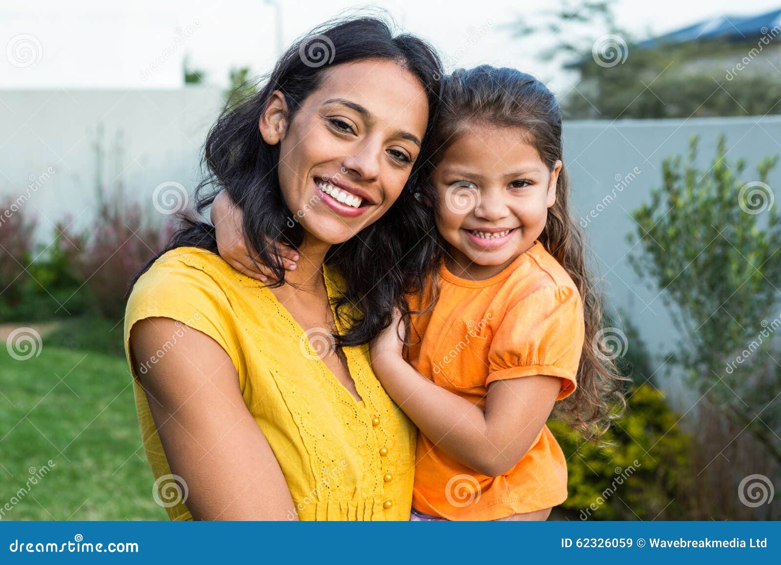 Standing Mother Holding Her Daughter Outdoors Stock Image - Image of ...