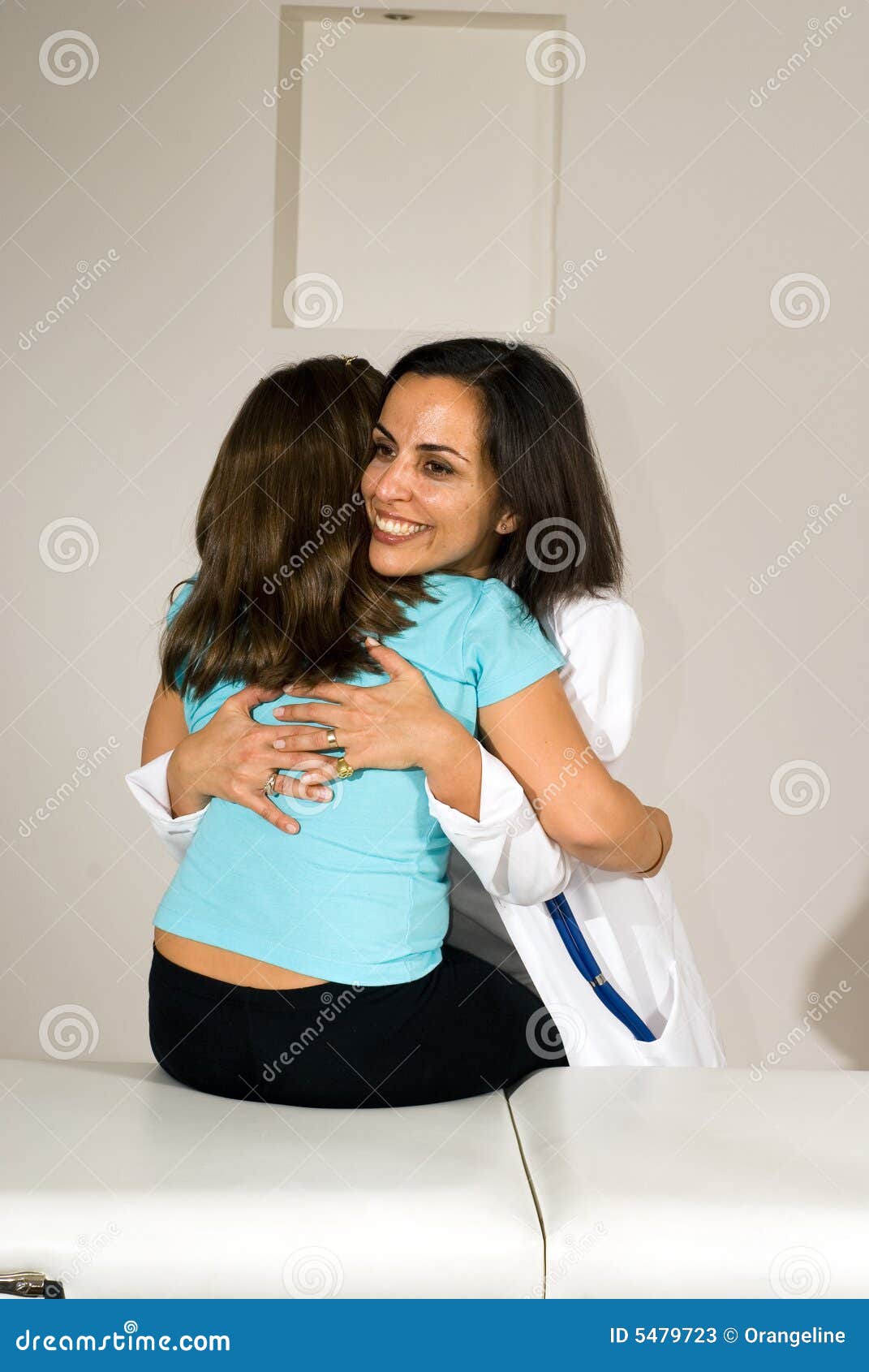 Standing Nurse Hugging a Patient Sitting on Bed Stock Image - Image of ...