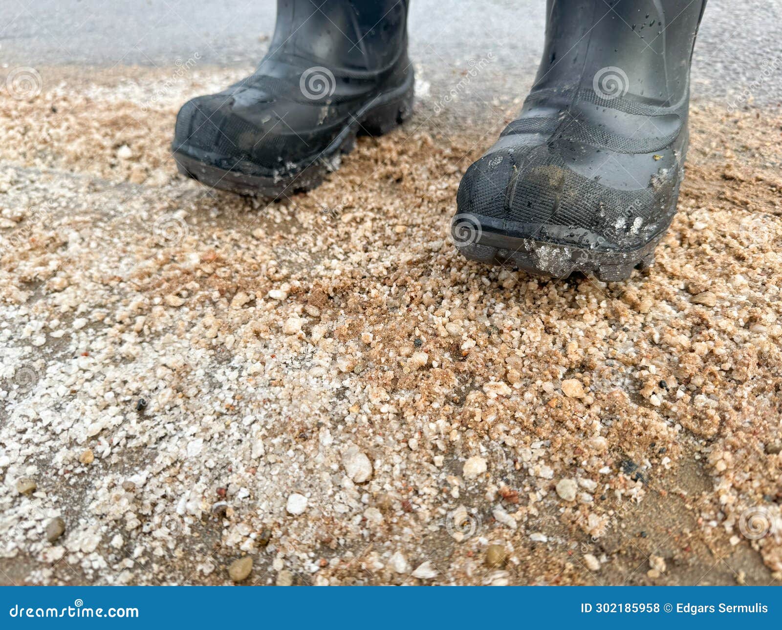 Standing with Rubber Boots on a Sandy Road with Salt Stock Photo ...
