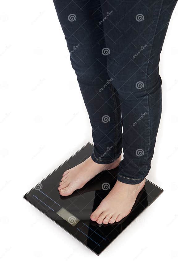 Standing on a scale stock image. Image of caucasian, beautiful - 18008379