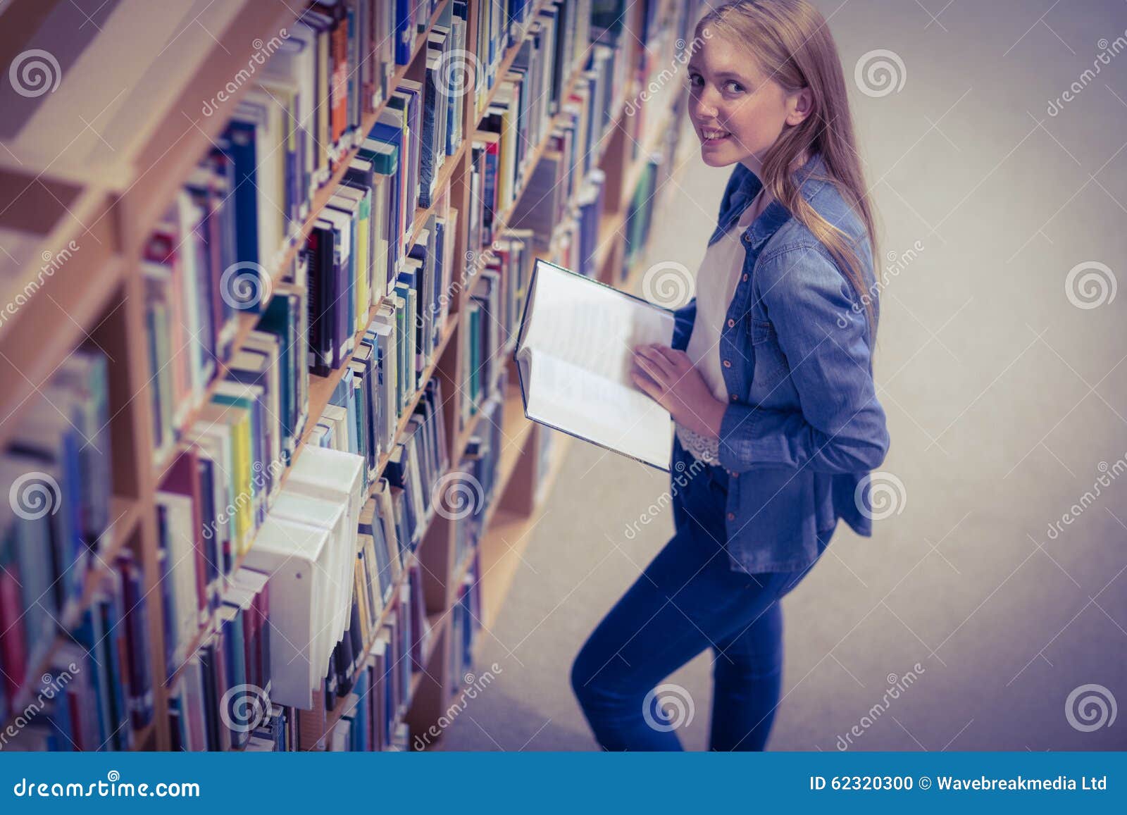 Standing Student Reading Book in Library Stock Photo - Image of school ...