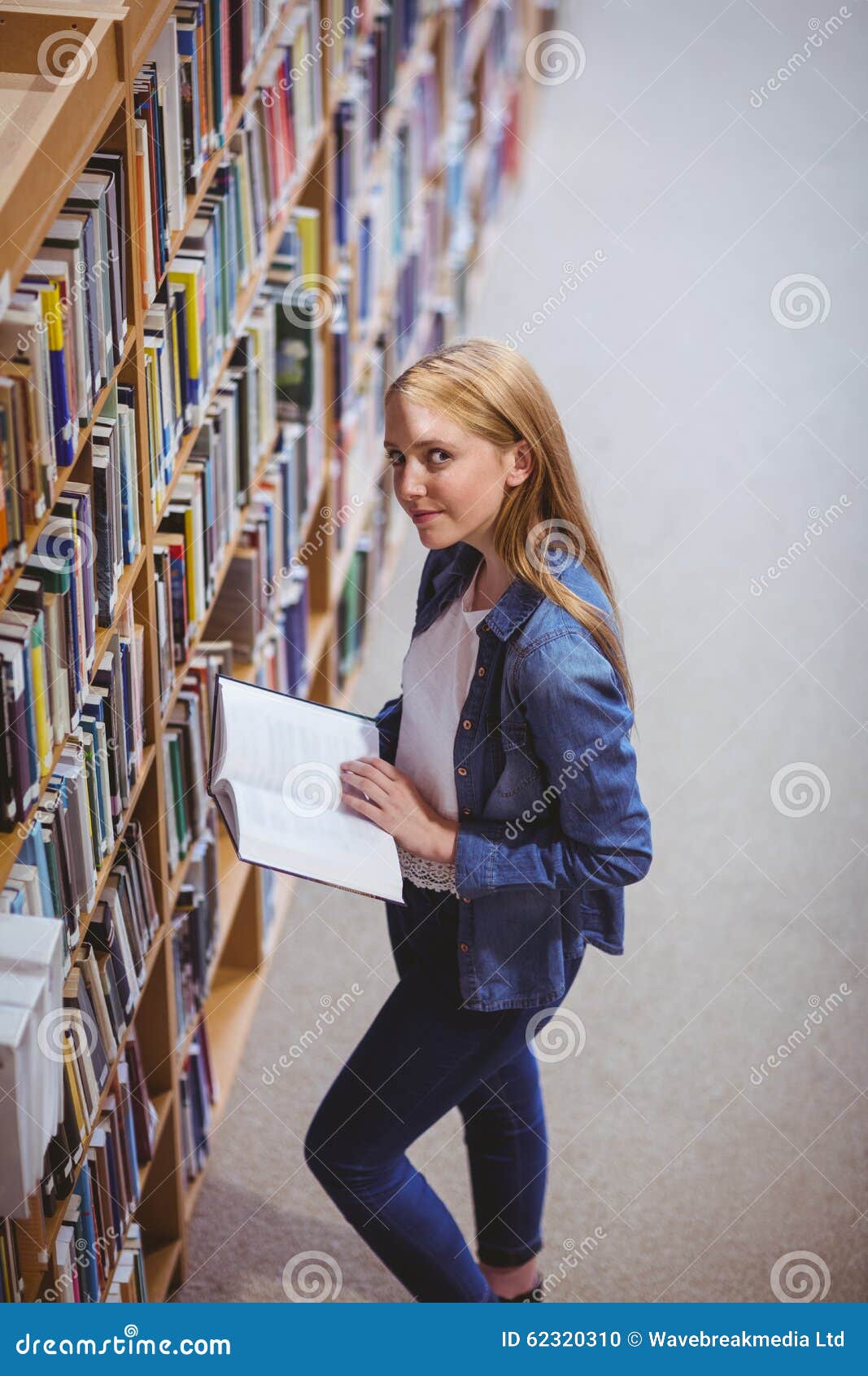 Standing Student Reading Book in Library Stock Photo - Image of casual ...