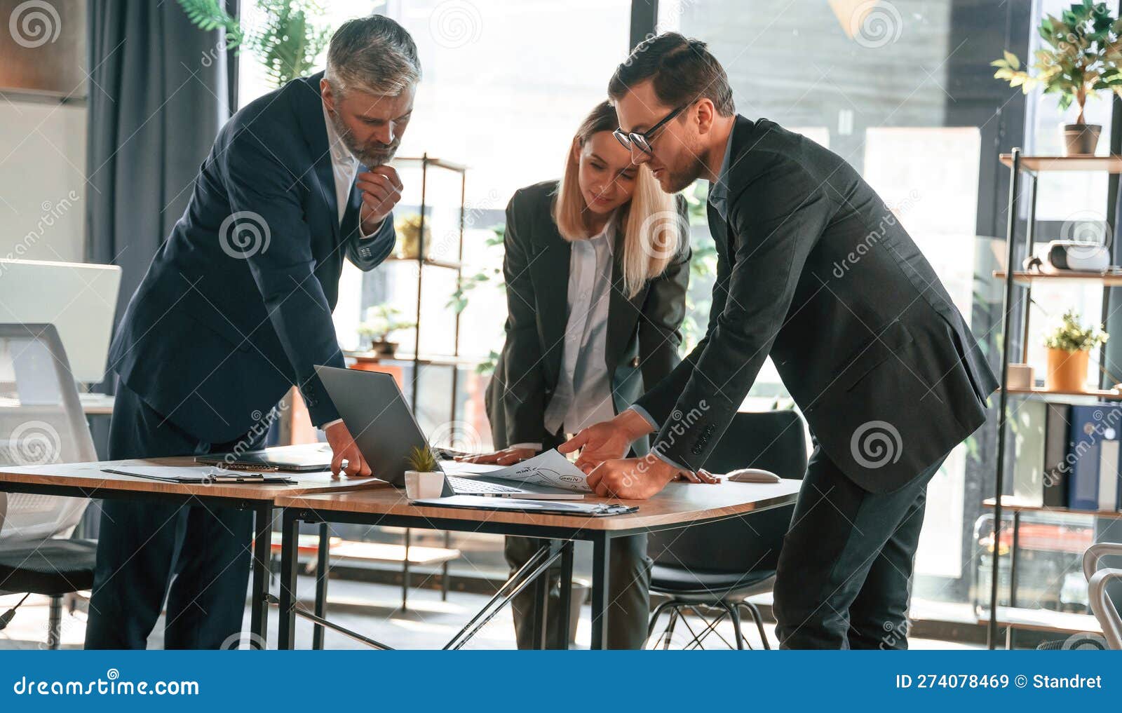 Standing by the Table. Group of Business People are Working in the ...