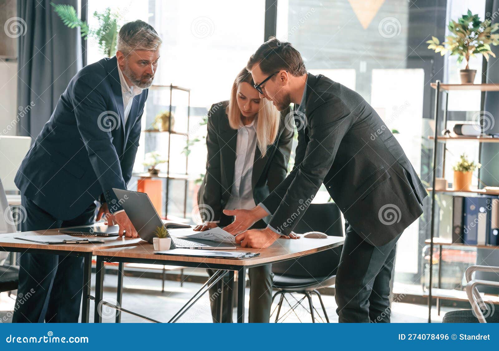 Standing by the Table. Group of Business People are Working in the ...