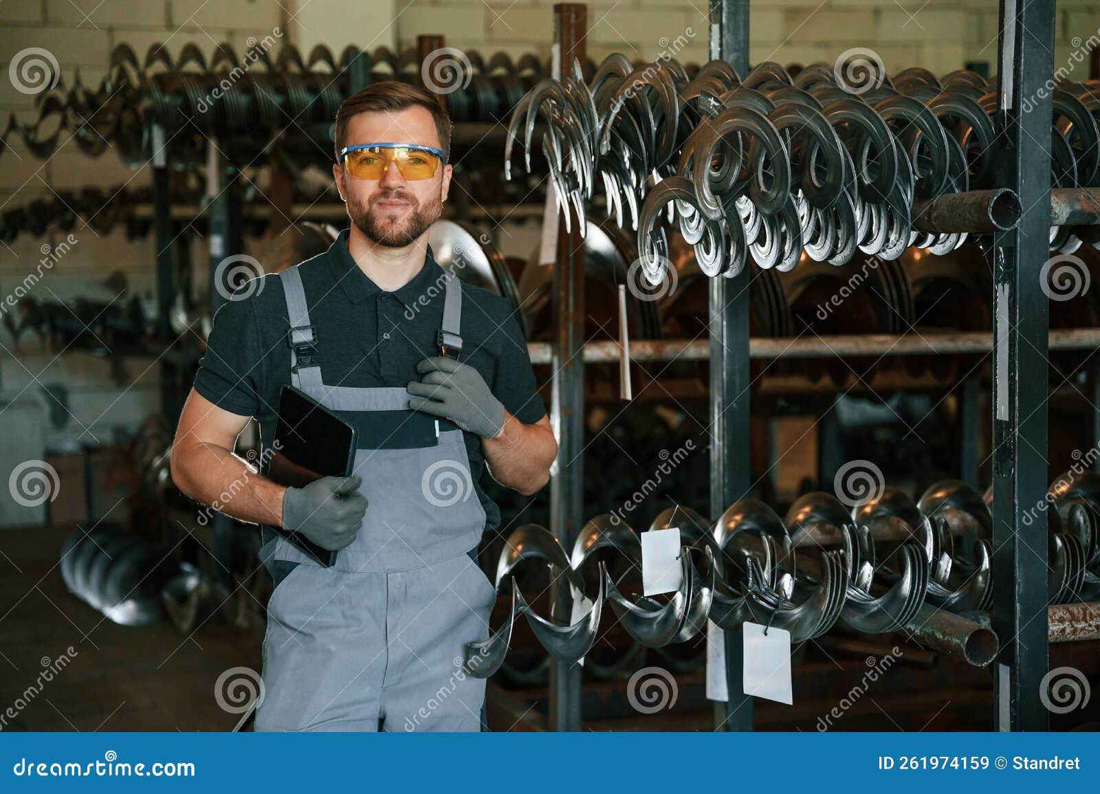 Standing with Tablet. Man in Uniform is in Workstation Developing ...