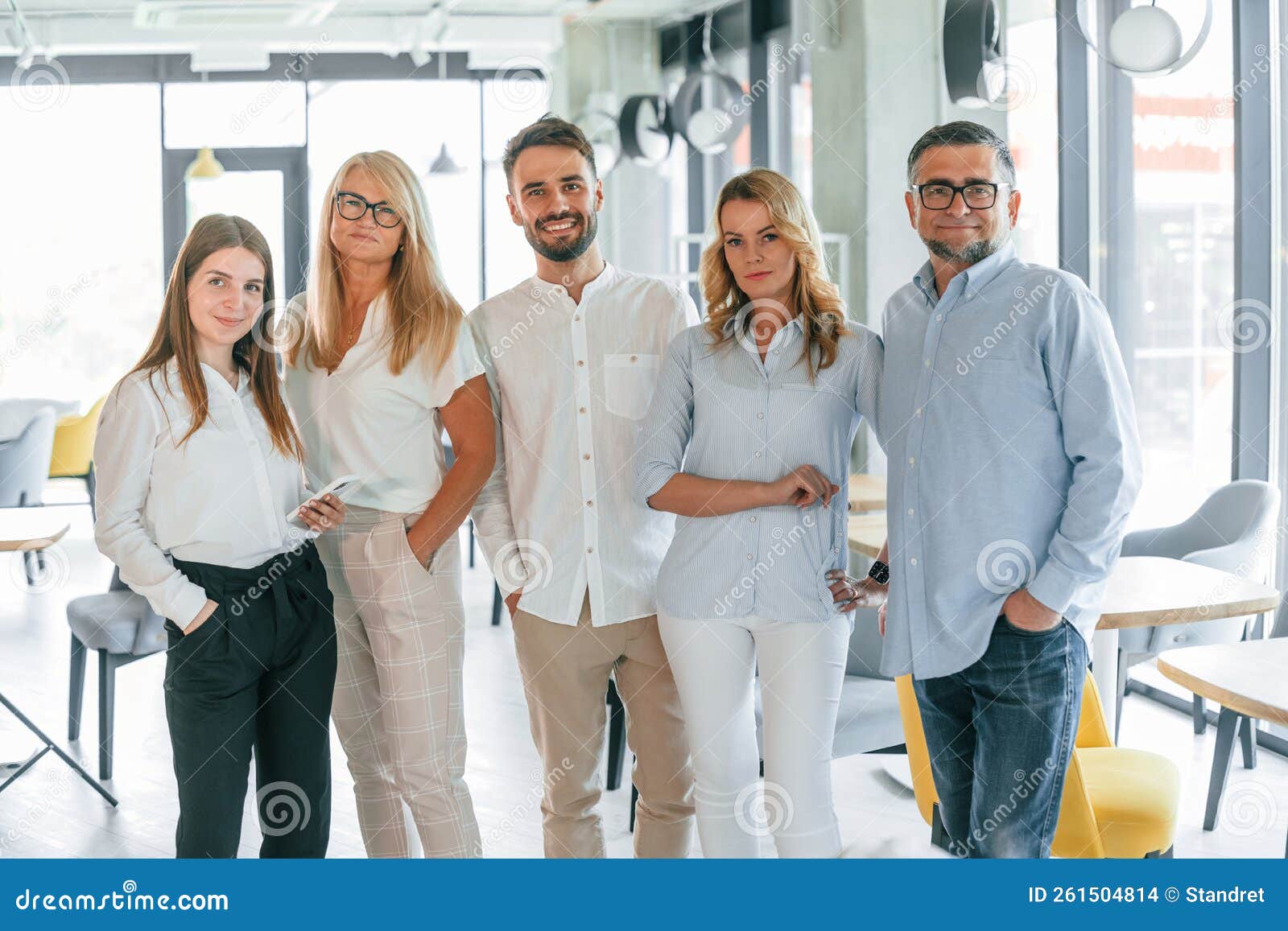 Standing Together and Posing for a Camera. Group of Professional ...