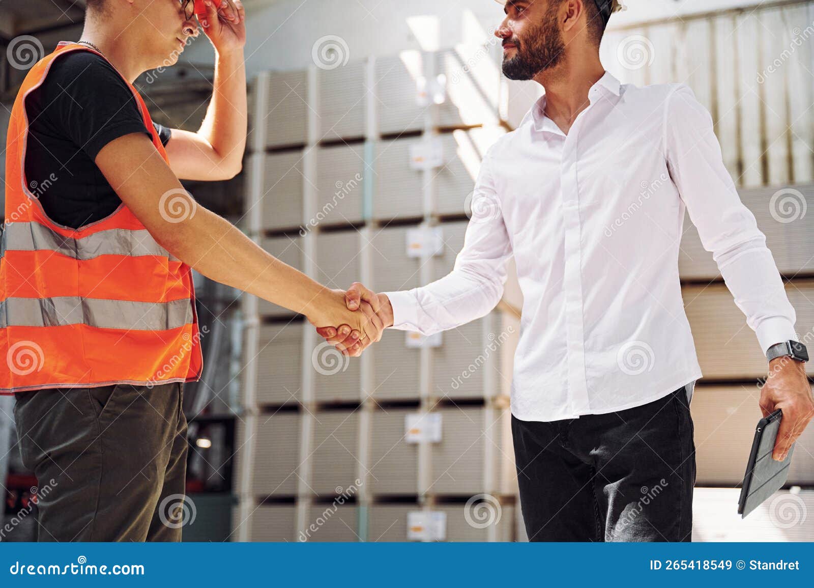 Standing Together. Two Storage Workers is in the Warehouse Stock Image ...