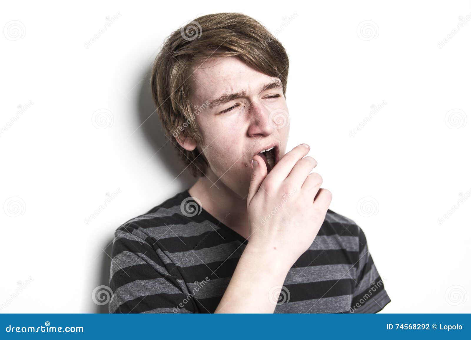 Standing Young Tired Man Yawning and Stretching Stock Photo - Image of ...