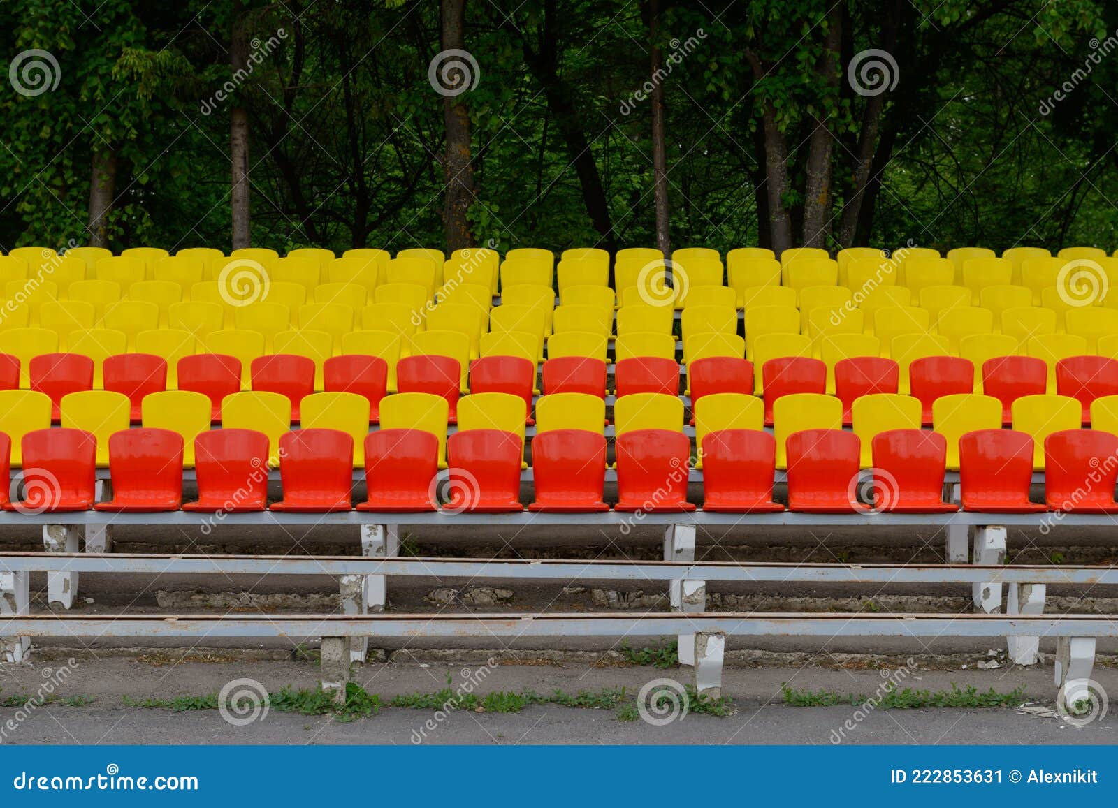 Stands Of A Small Stadium With Rows Of Yellow And Red Seats Royalty ...