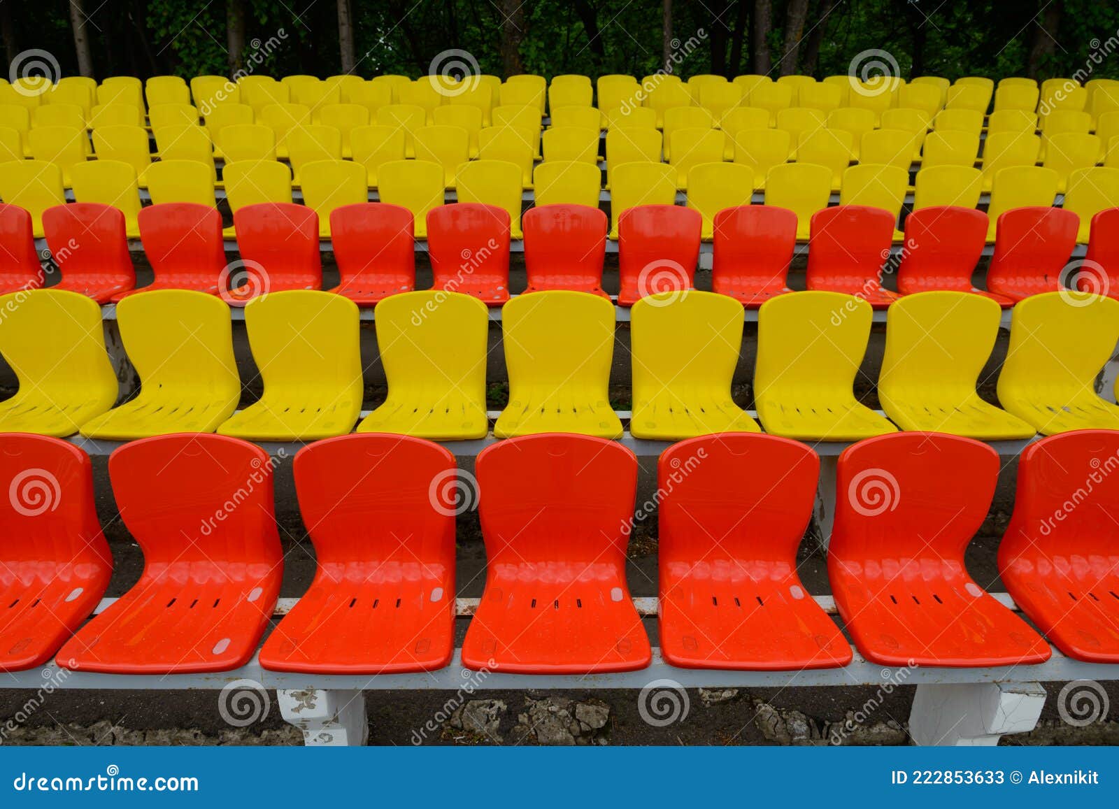 Stands of a Small Stadium with Rows of Yellow and Red Seats Stock Image ...