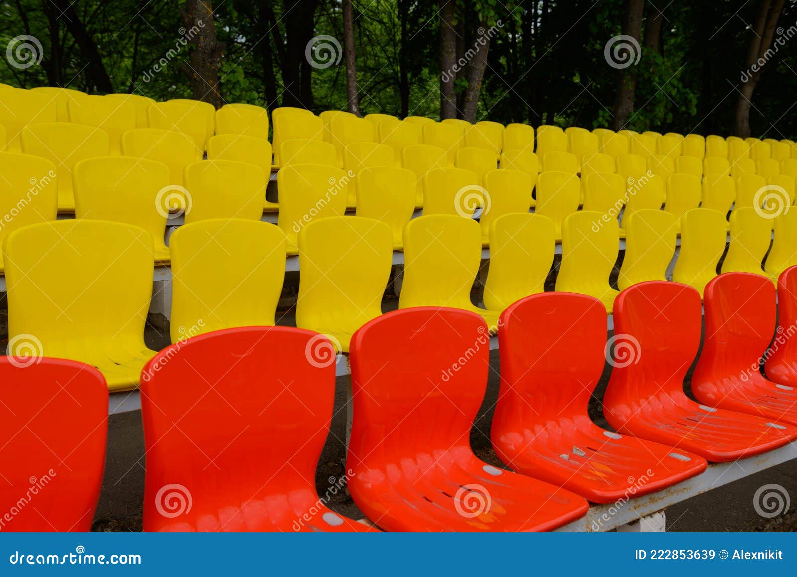 Stands Of A Small Stadium With Rows Of Yellow And Red Seats Stock Image ...