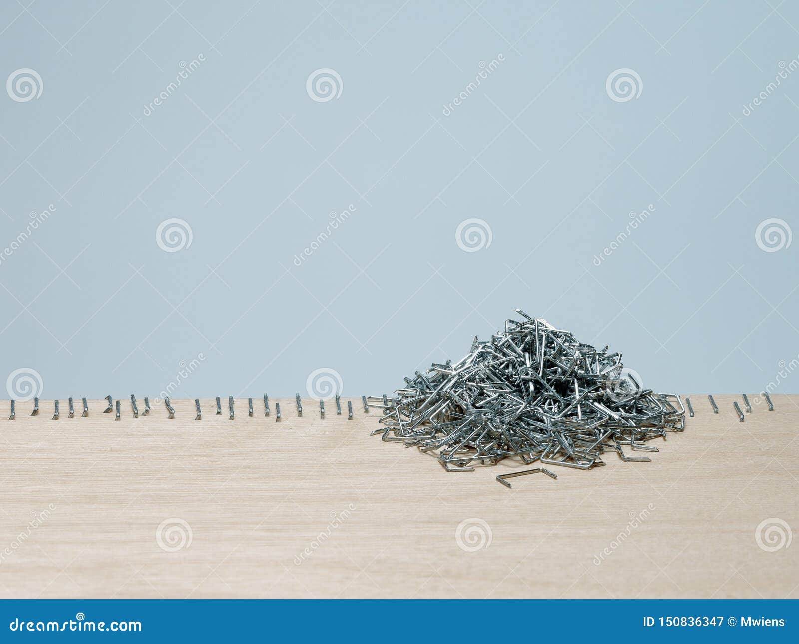 Staple Gun Malfunctions Creating Precise Row and Random Pile of Staples ...