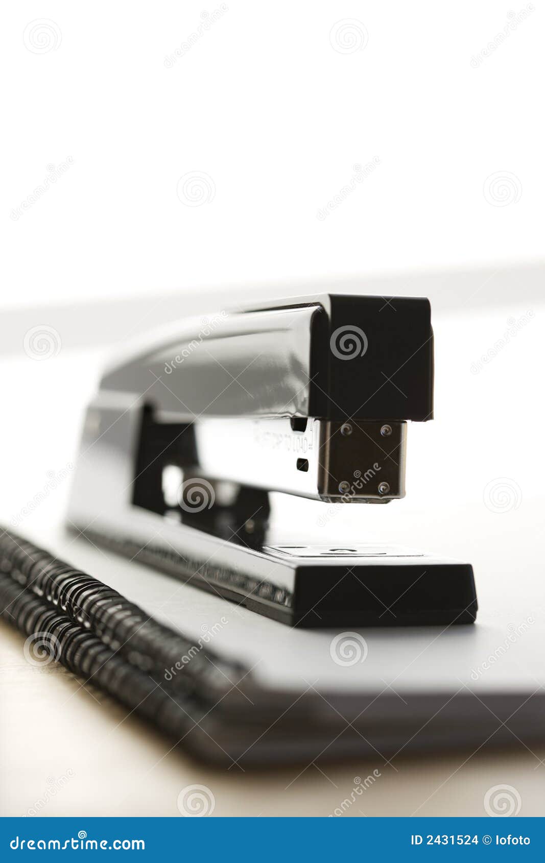 Stapler on notebook. stock photo. Image of color, selective - 2431524