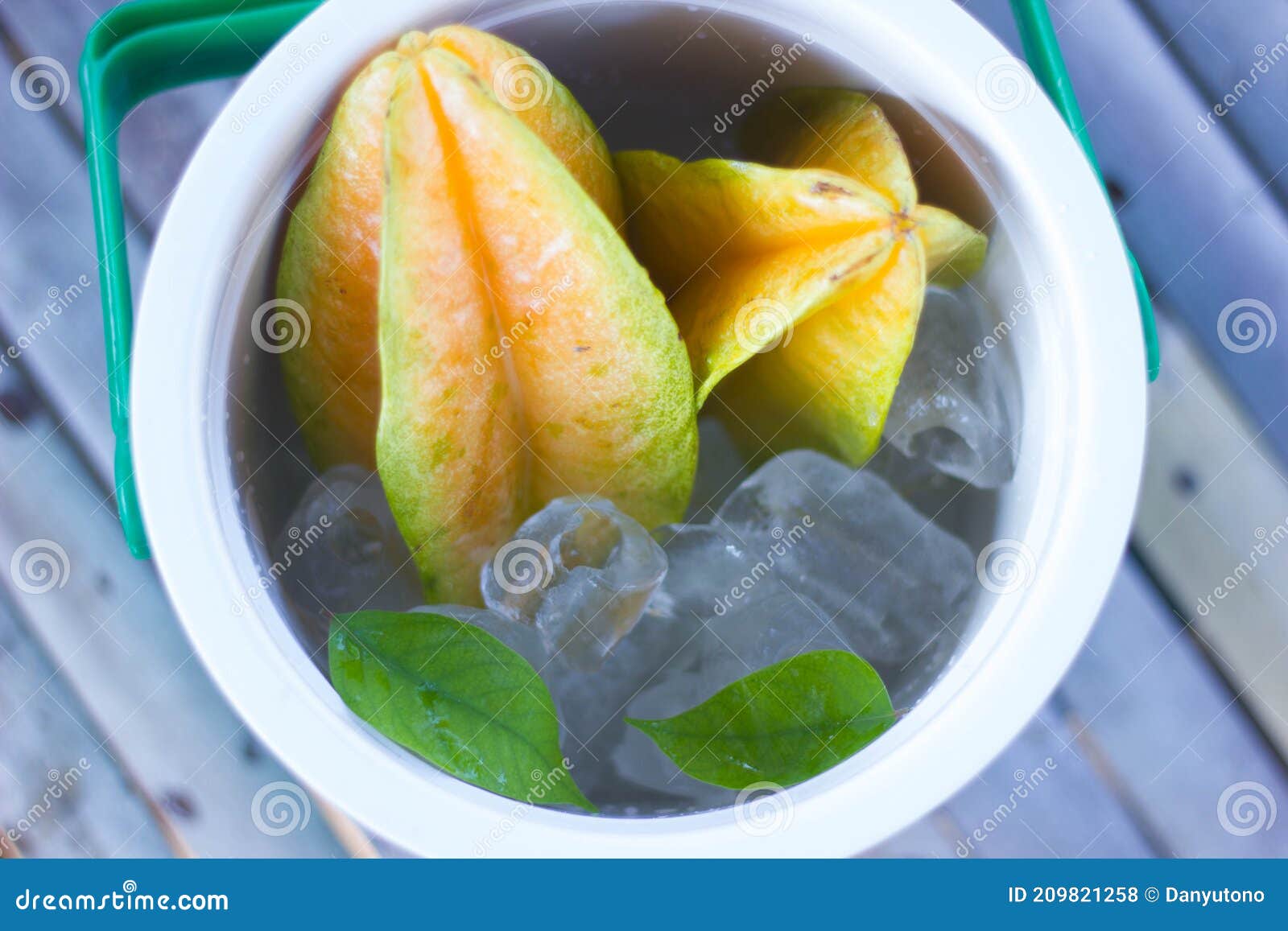 Star fruit on ice box stock photo. Image of fruits, star - 209821258