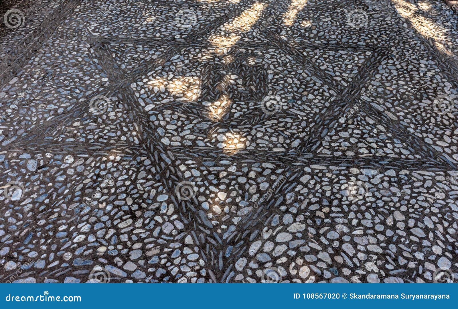 Star Pattern with a Rose on a Stone Walking Path at the Alhambra Stock ...
