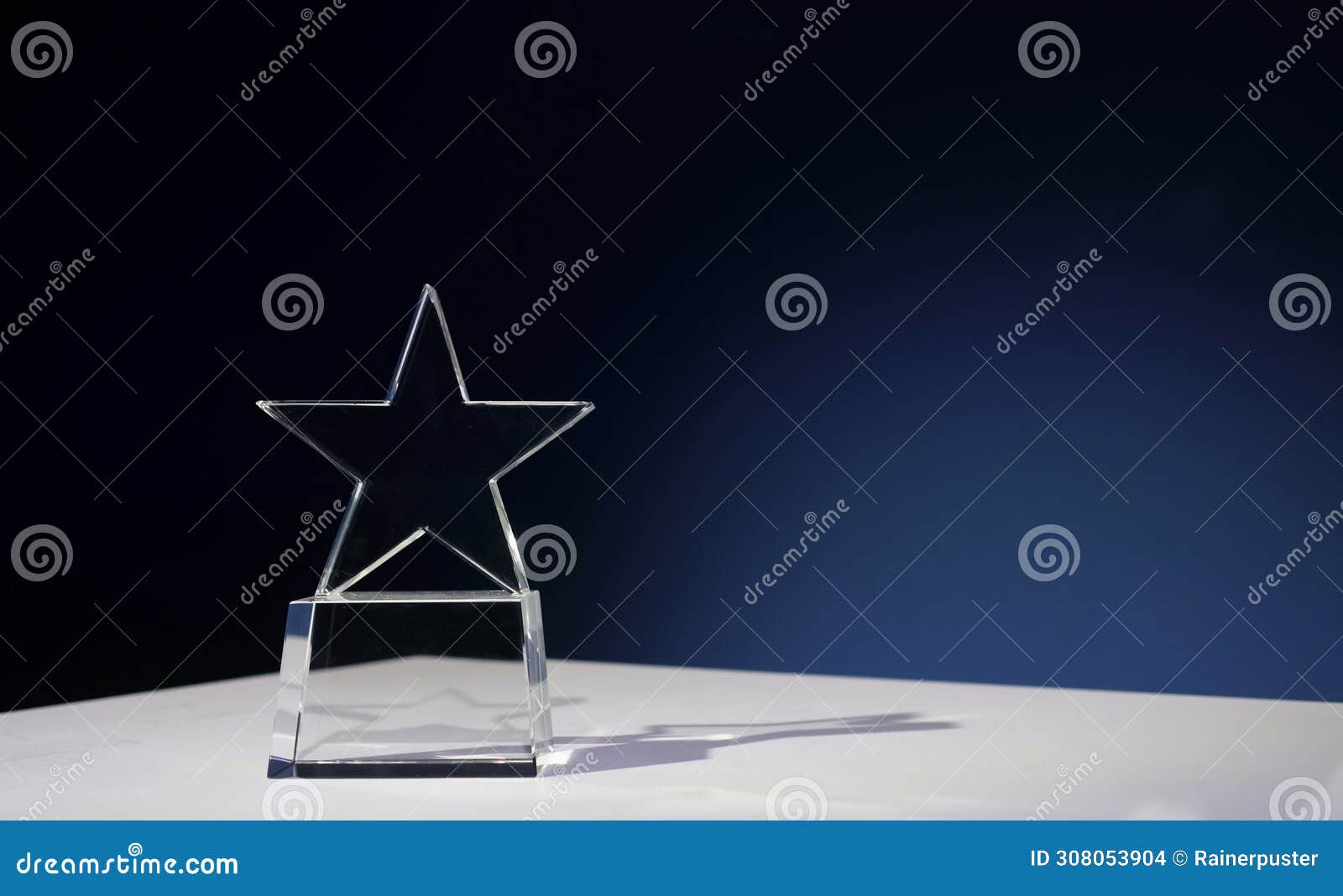 Star-shaped Award Made of Glass on a White Table Stock Photo - Image of ...