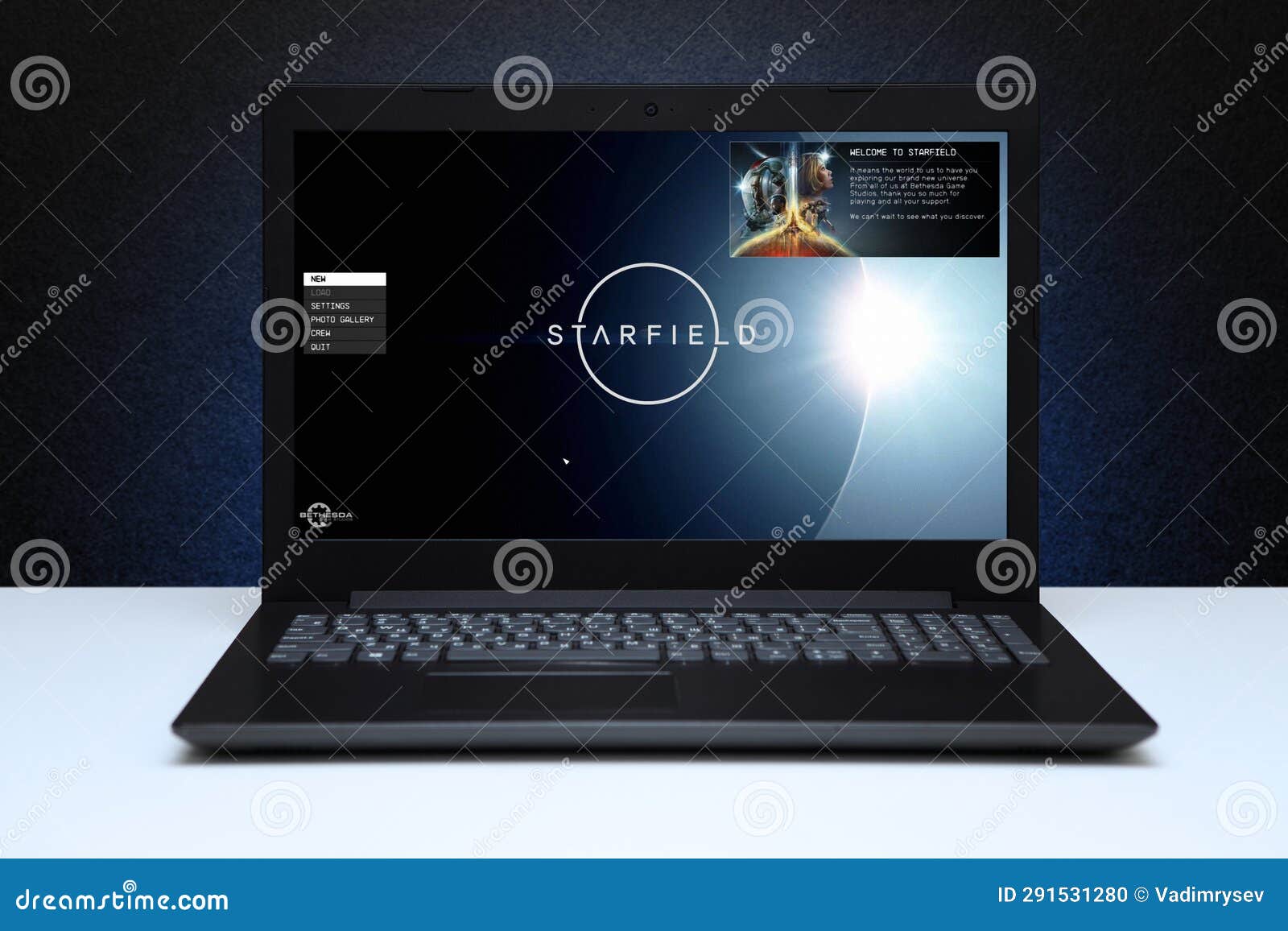 Starfield Game on the Screen Laptop Computer on Black Textured Wall ...