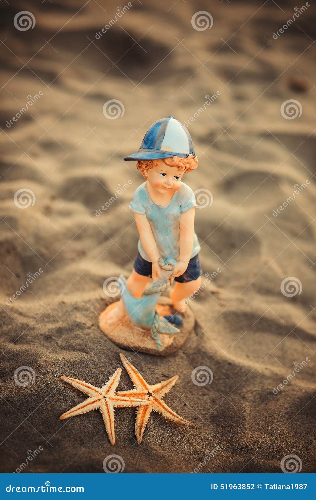 Starfish with the Figure of a Boy on the Sand Stock Photo - Image of ...