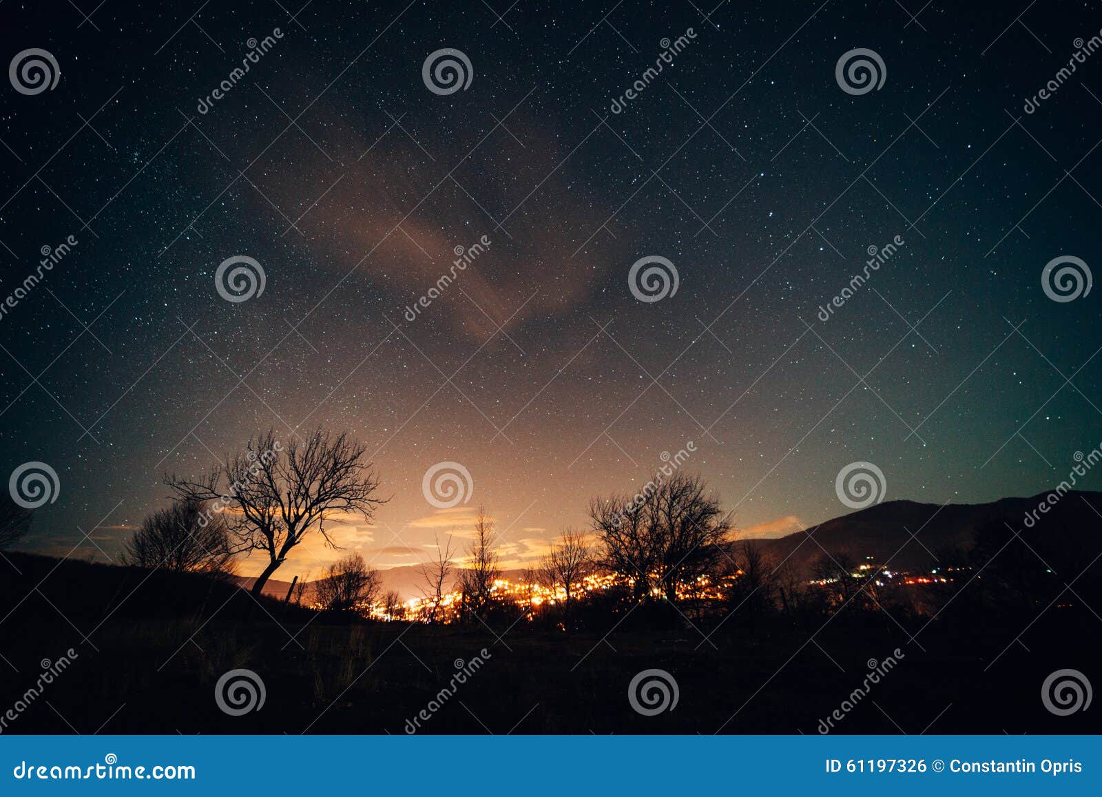 Starry night sky over town stock photo. Image of stars - 61197326